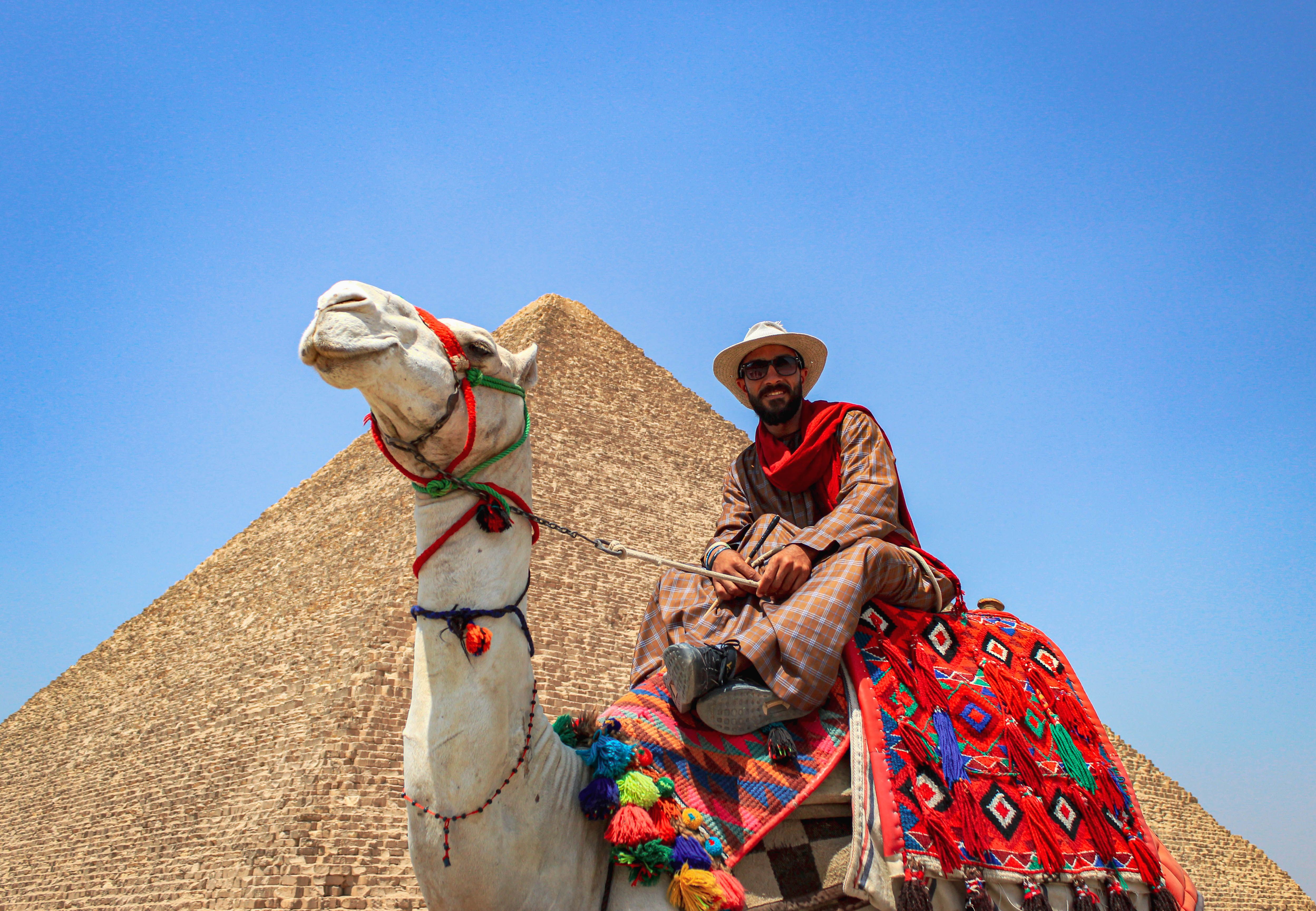 A Man Riding a Camel · Free Stock Photo