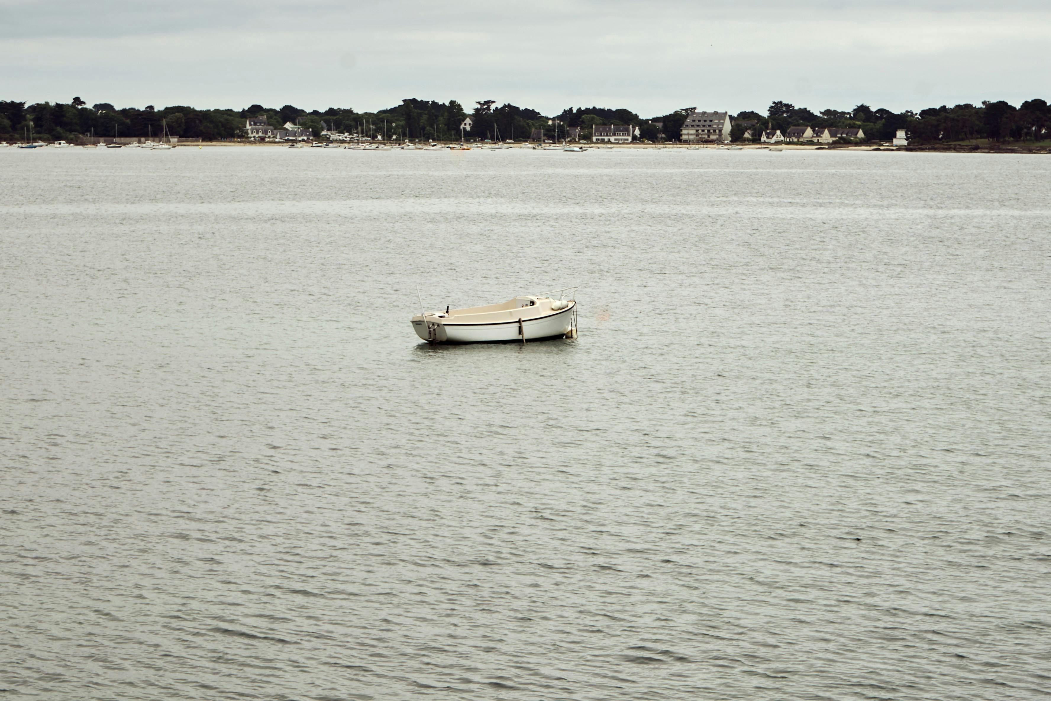 An Empty Boat in the Sea · Free Stock Photo