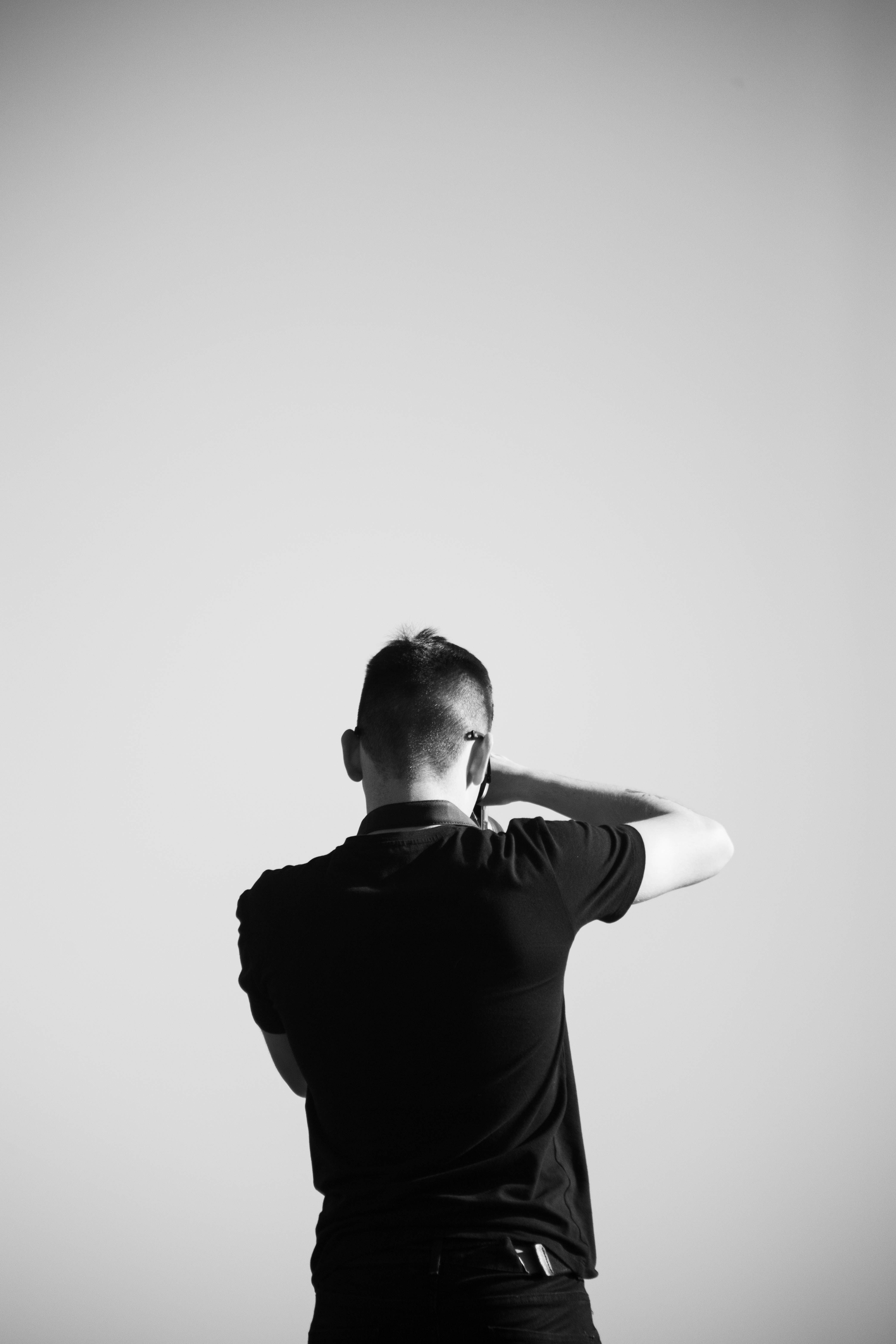 A Back View of a Man in Black Shirt · Free Stock Photo