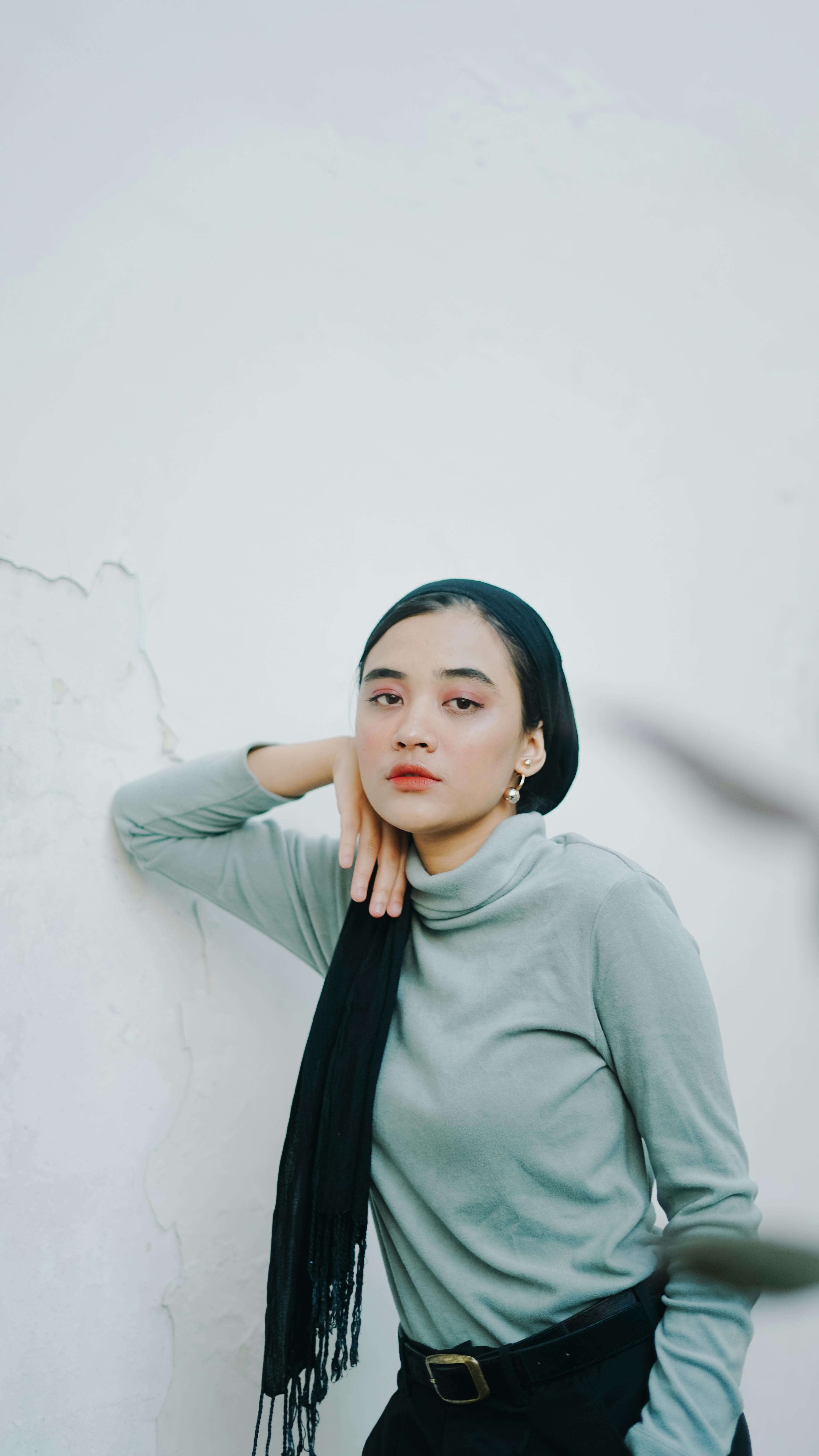 Portrait of a Woman Next to a Wall · Free Stock Photo
