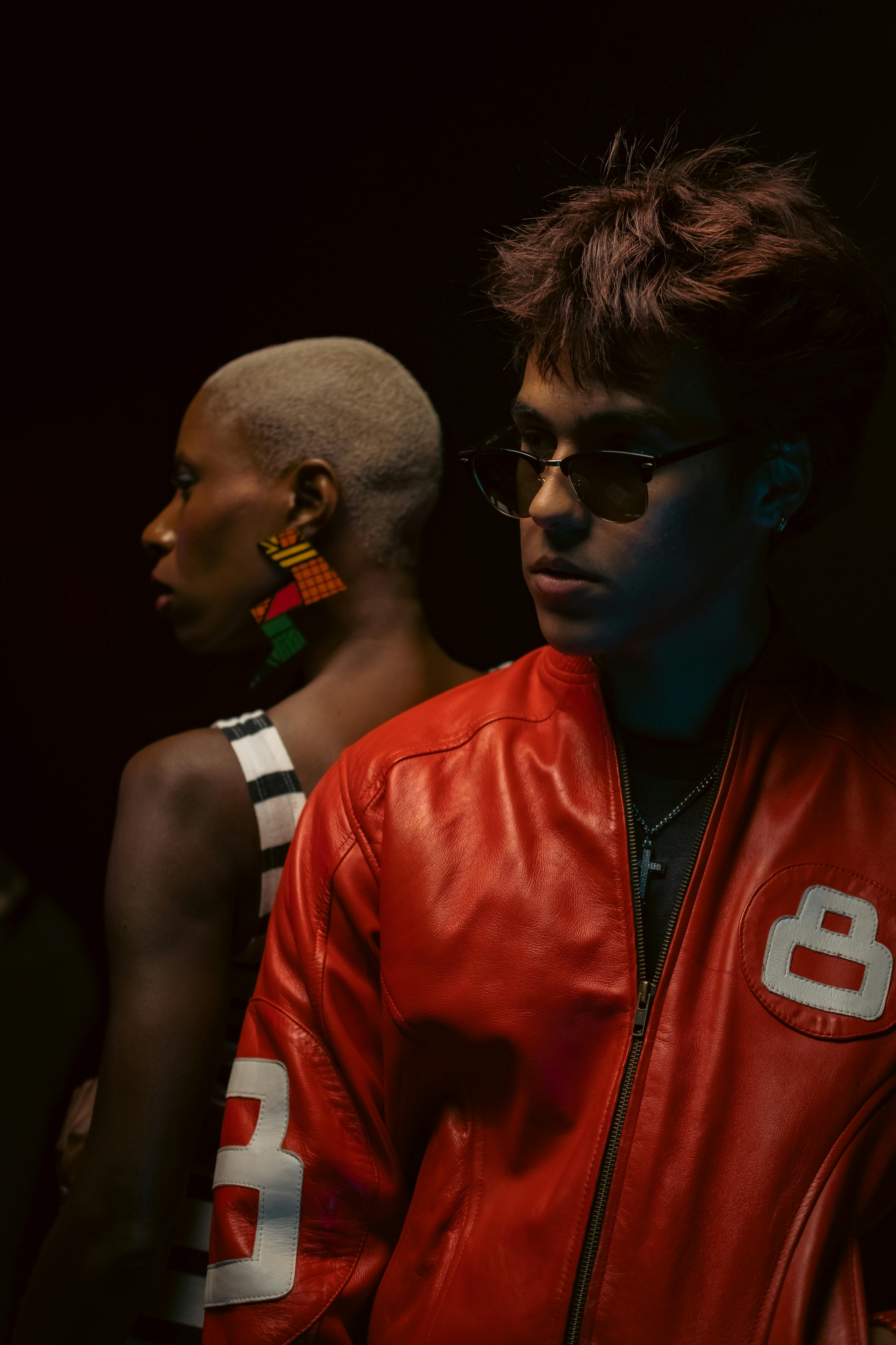 Two Fashion Models Posing in the Dark · Free Stock Photo