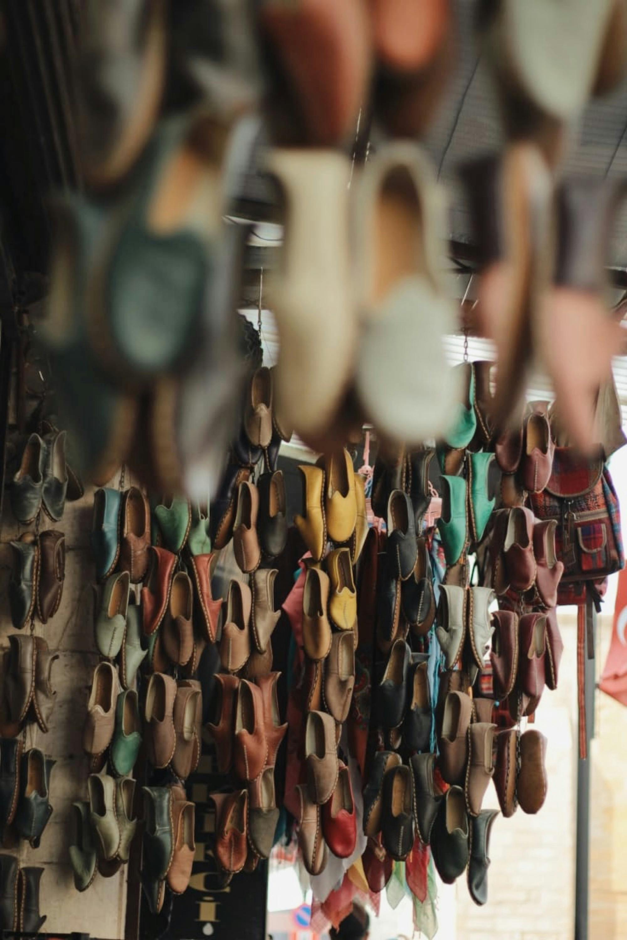 Shoes Hanging on Market Stall · Free Stock Photo