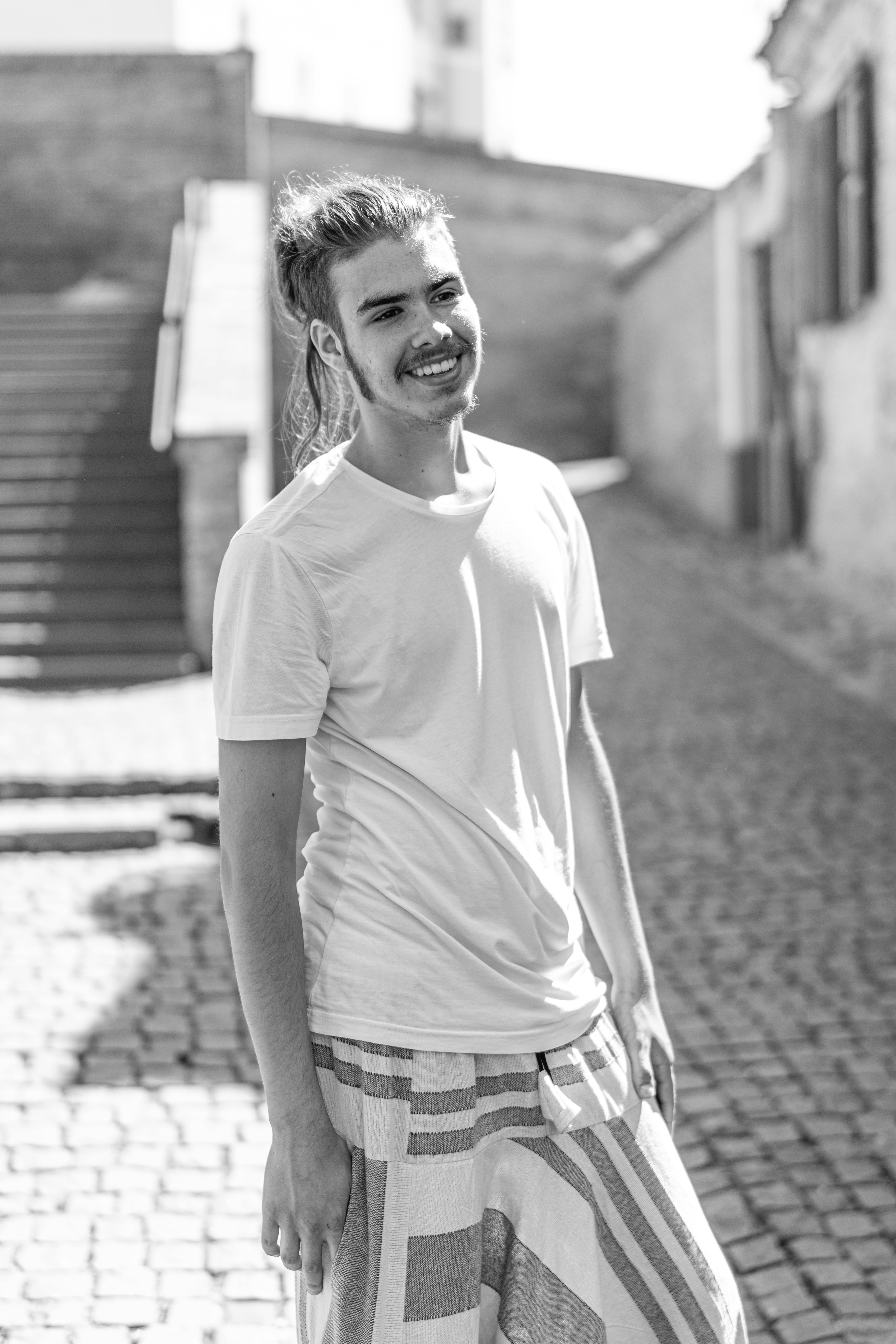 Smiling Man on Ancient City Street · Free Stock Photo