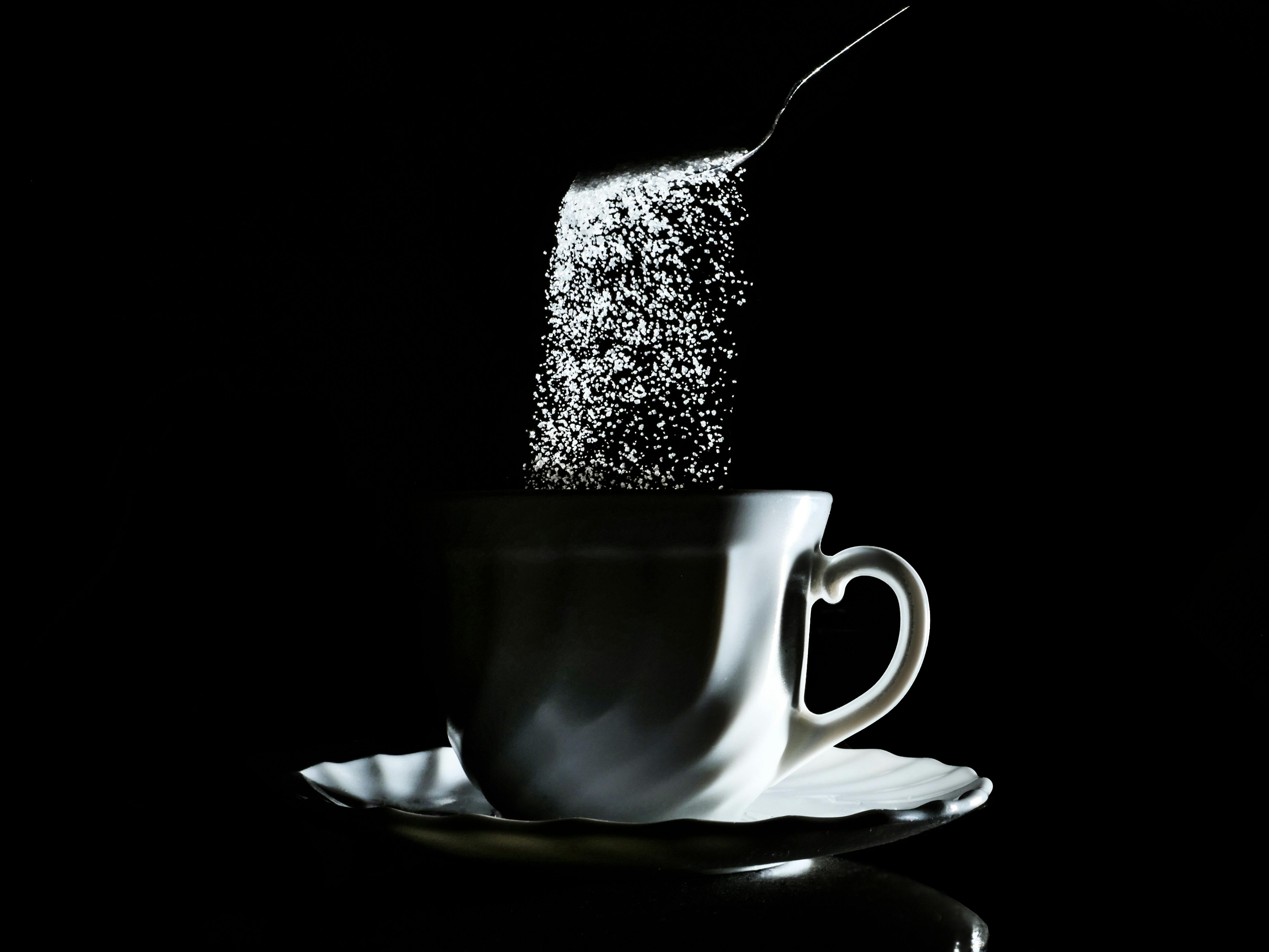 Sugar Falling into Coffee Cup · Free Stock Photo