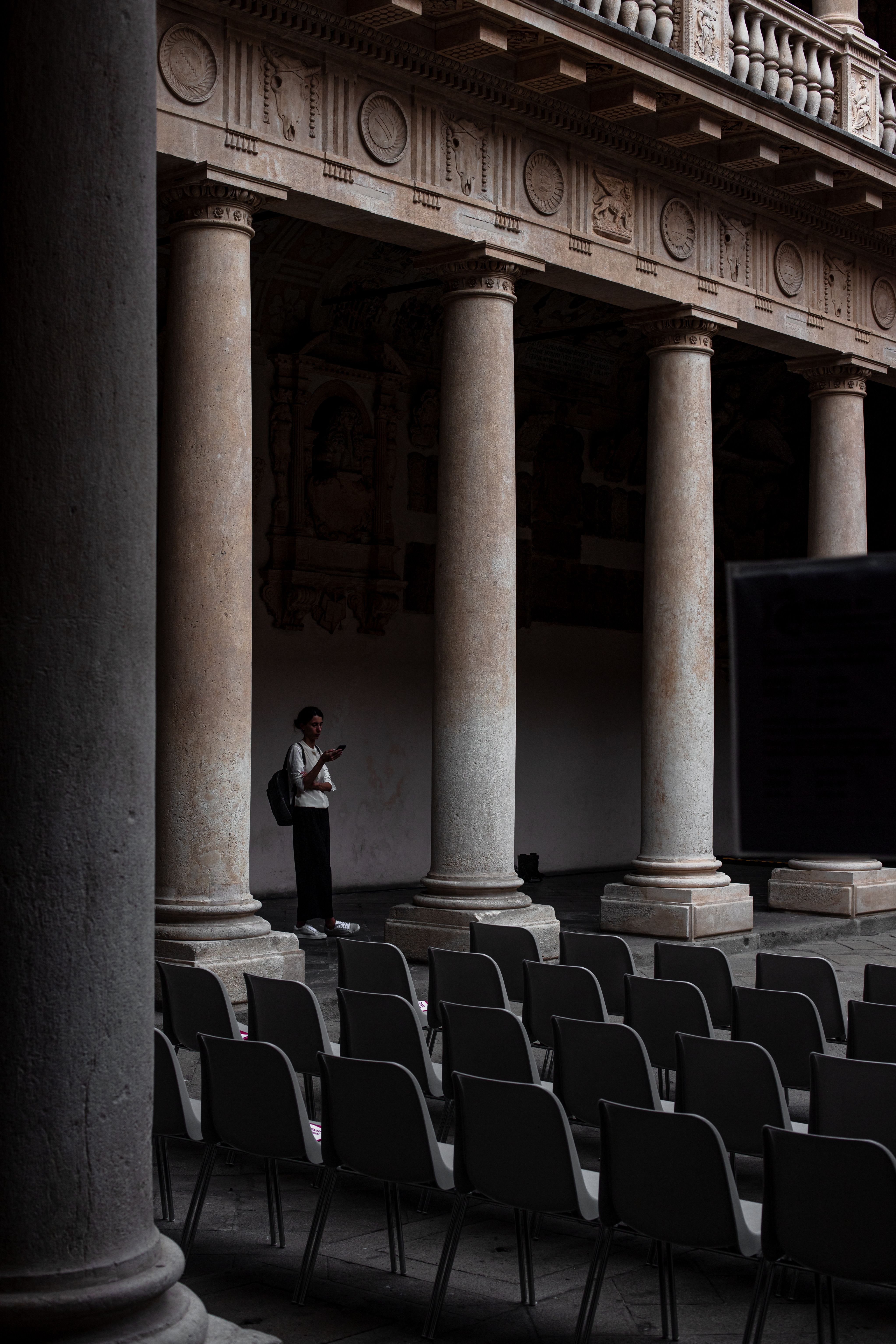 Chairs on a Square Among Columns · Free Stock Photo