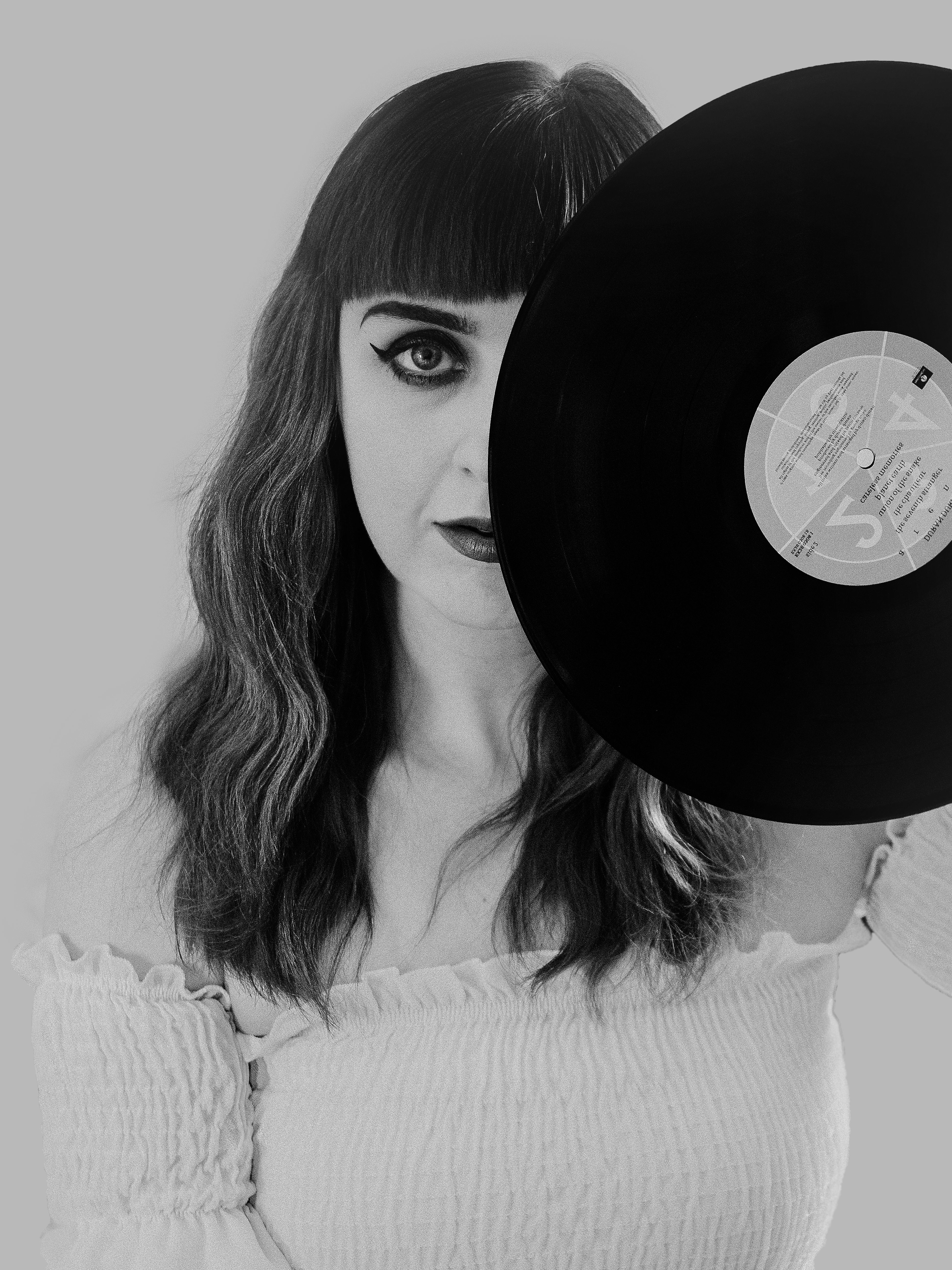 Black and White Portrait of a Woman Holding a Vinyl Record · Free Stock ...