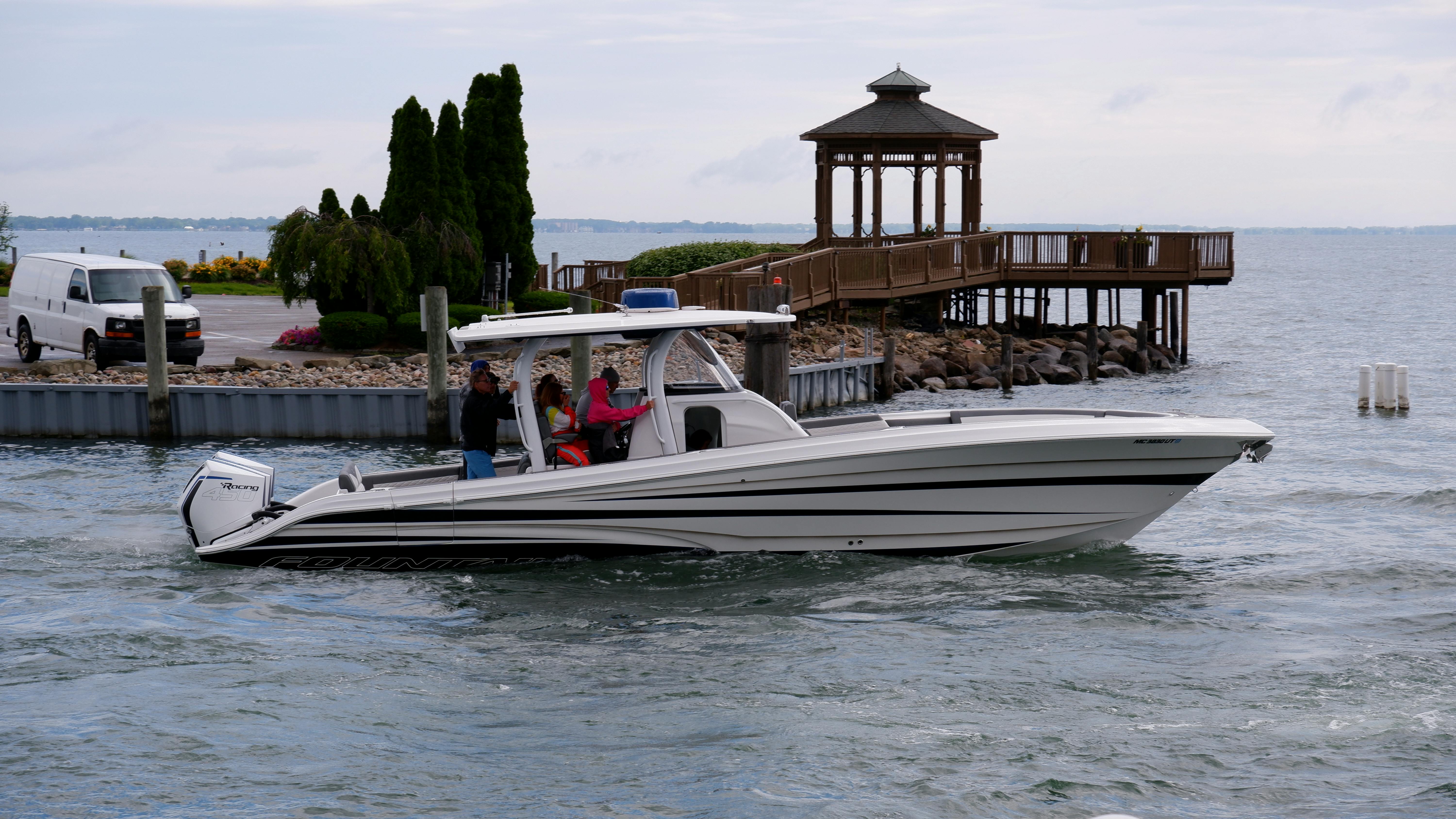 People Riding on White and Blue Motorboat on Sea · Free Stock Photo
