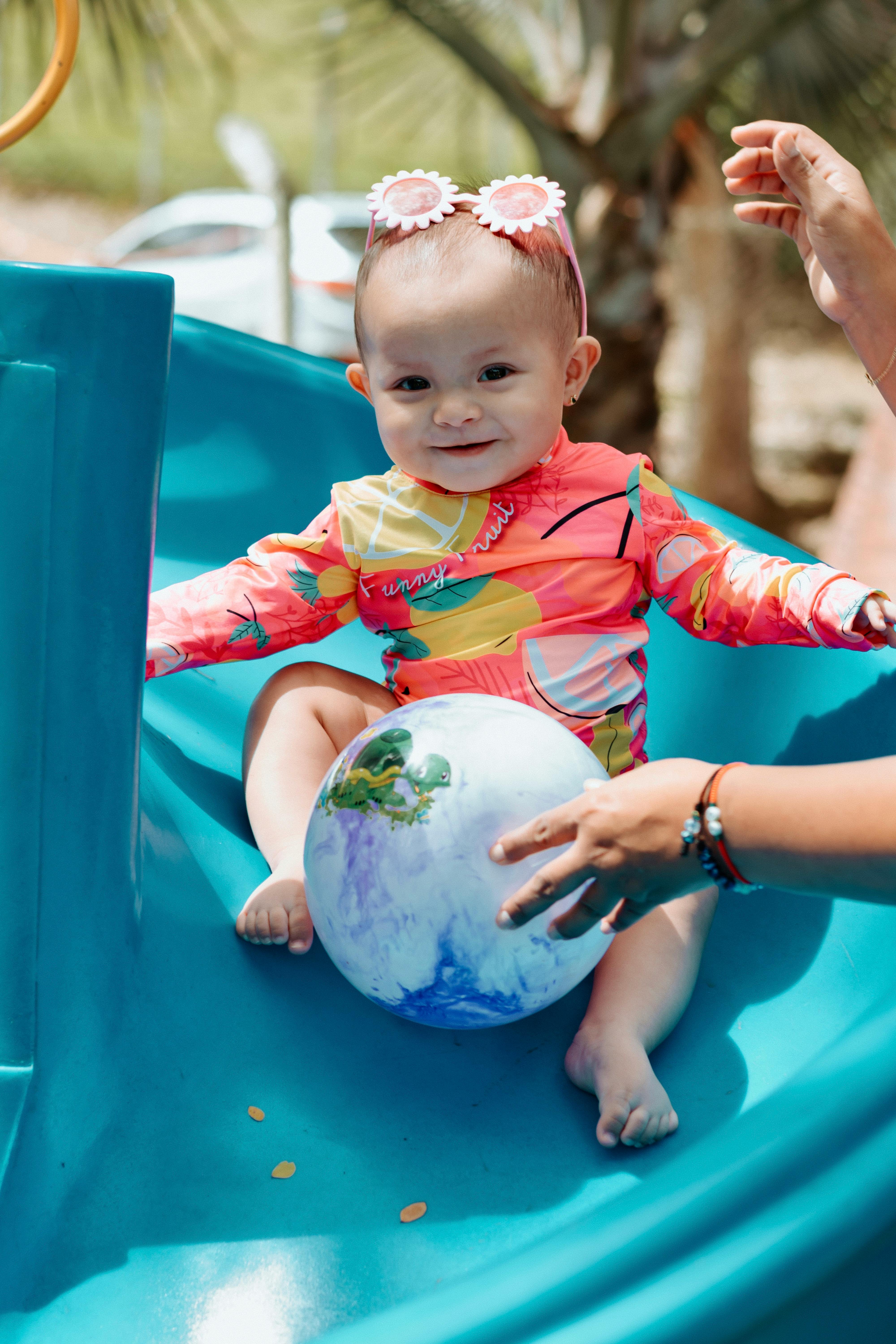 A Cute Baby on a Slide · Free Stock Photo