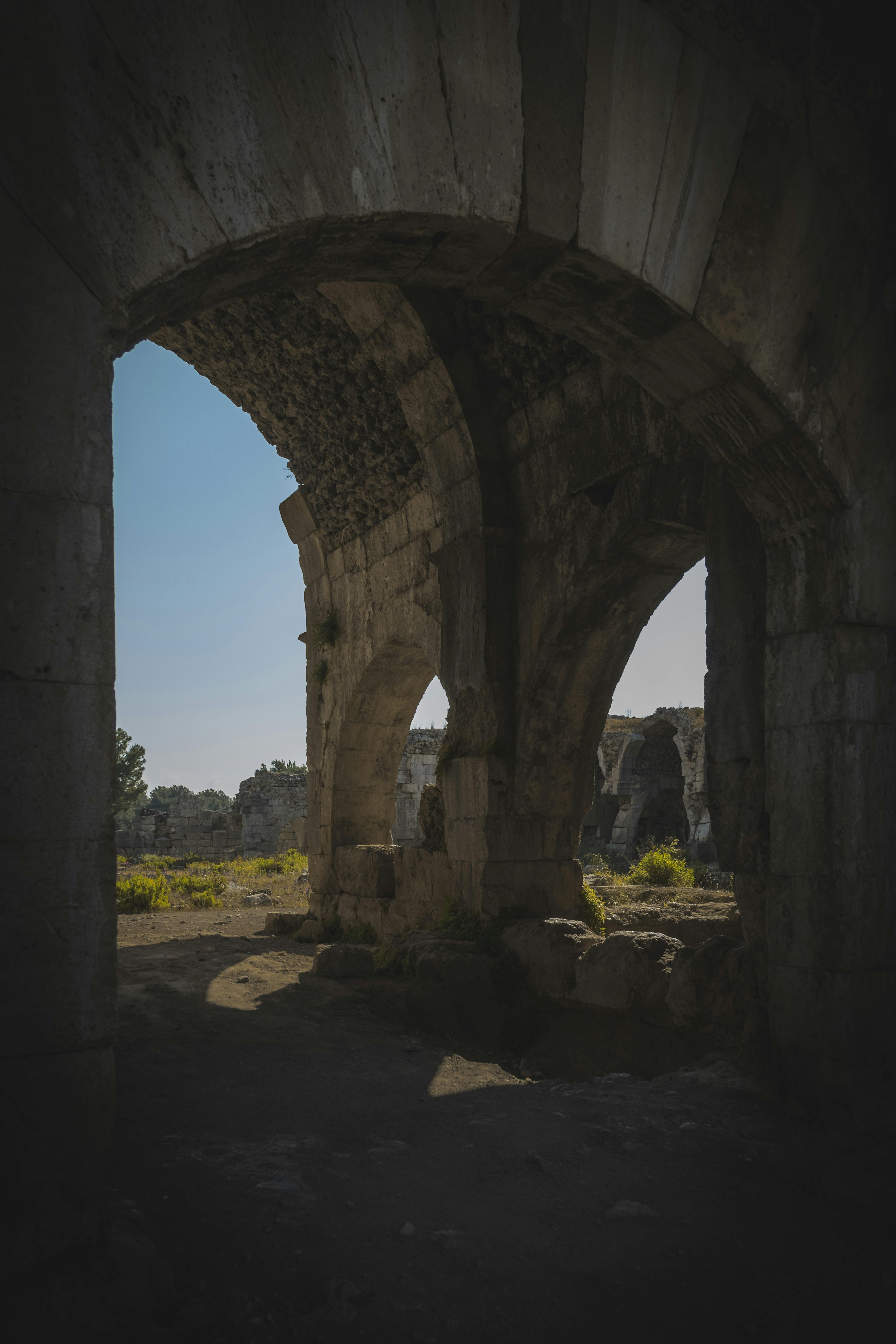 An Abandoned Stone Building with Half Arched Opening · Free Stock Photo