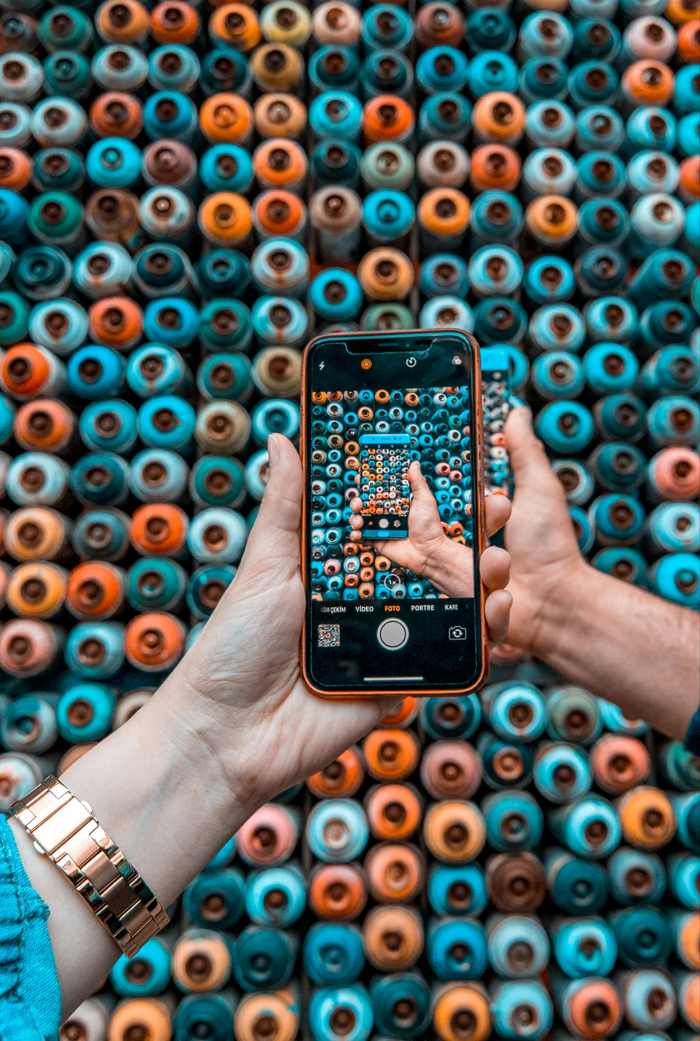 Hand of a Person Photographing Rows of Various Spools With a Smart ...