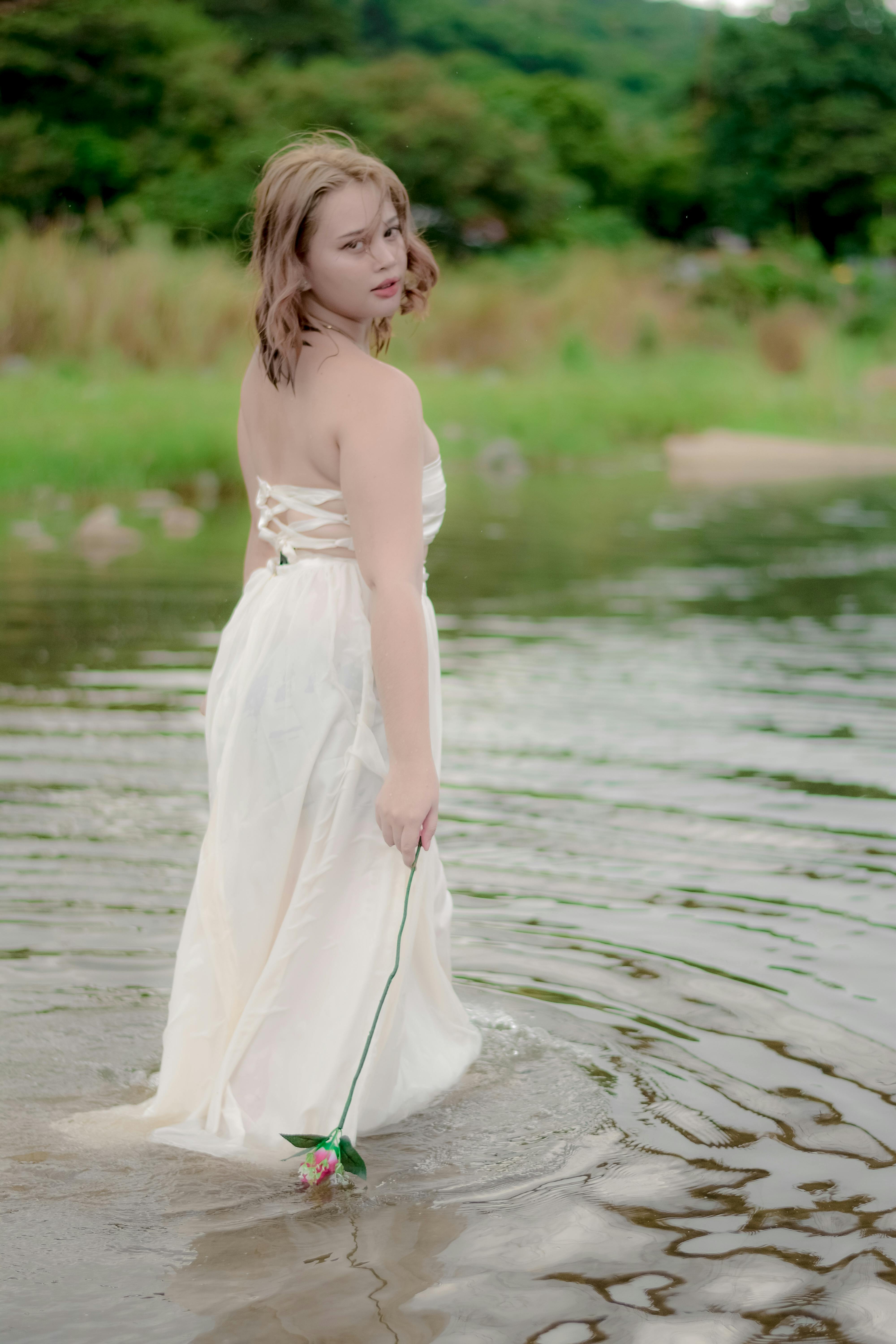 Woman In Dress Looking Over Water Photos, Download The BEST Free Woman ...