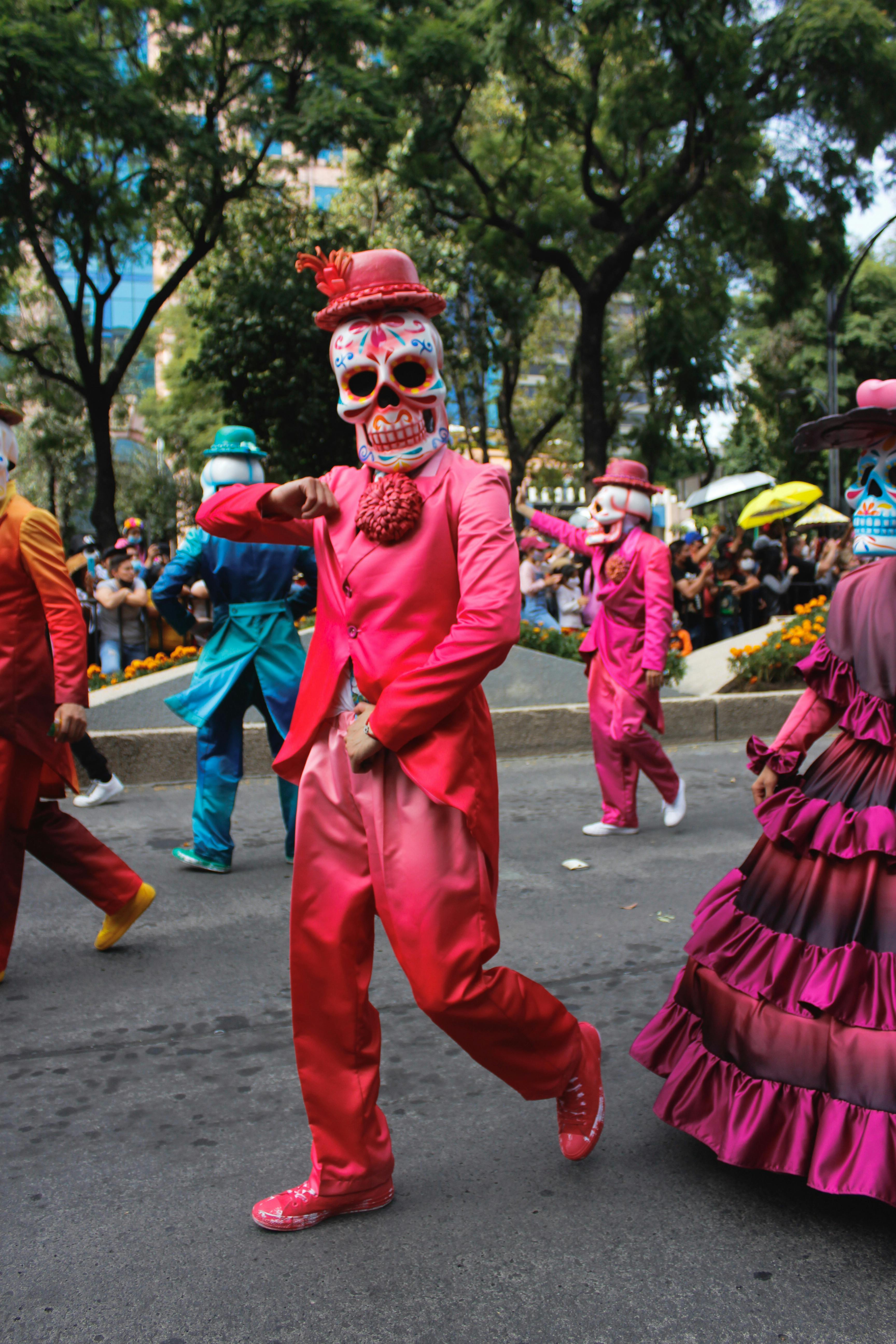 Women Wearing Costumes Walking on a Parade · Free Stock Photo