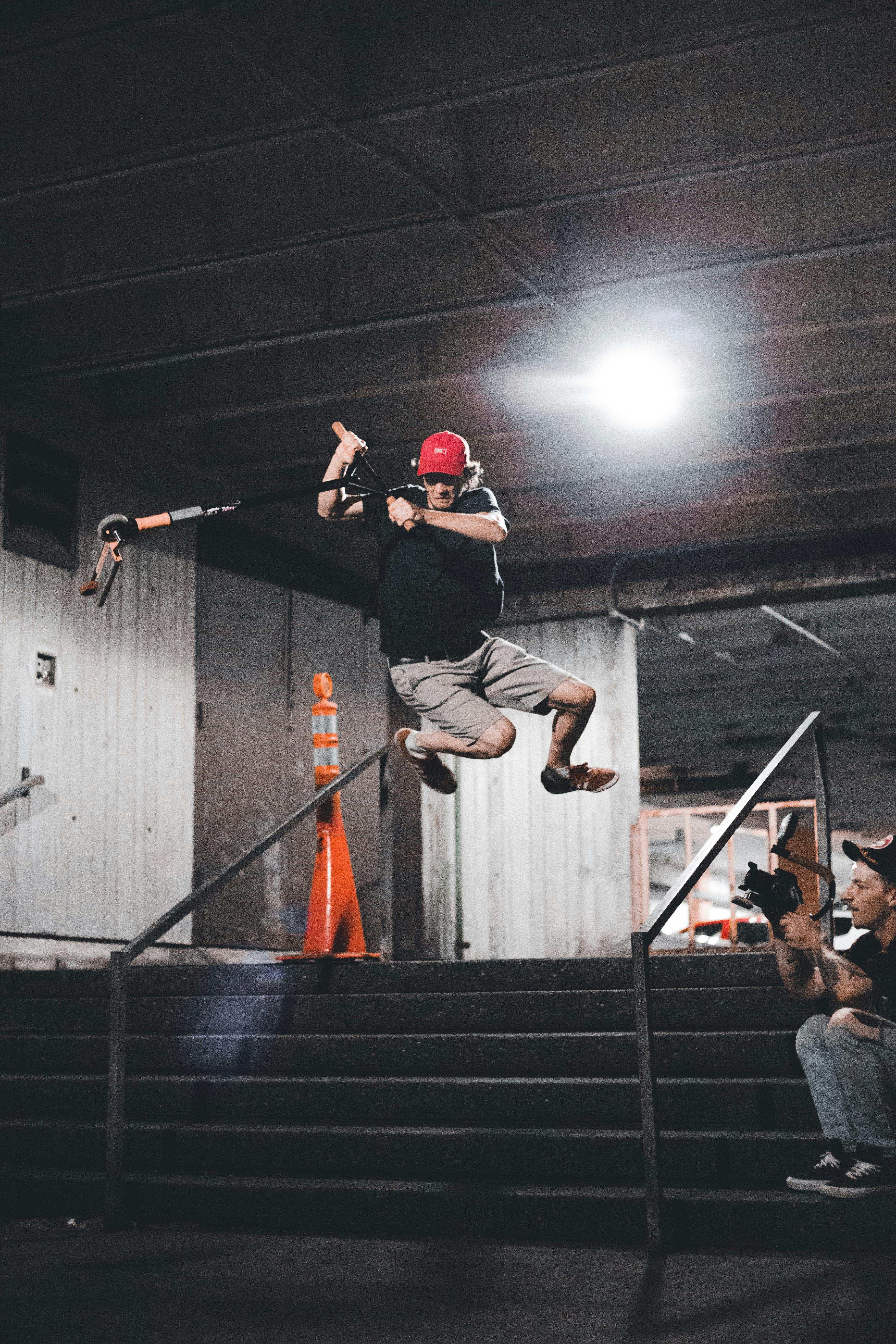 Man Jumping Off Steps on Scooter · Free Stock Photo