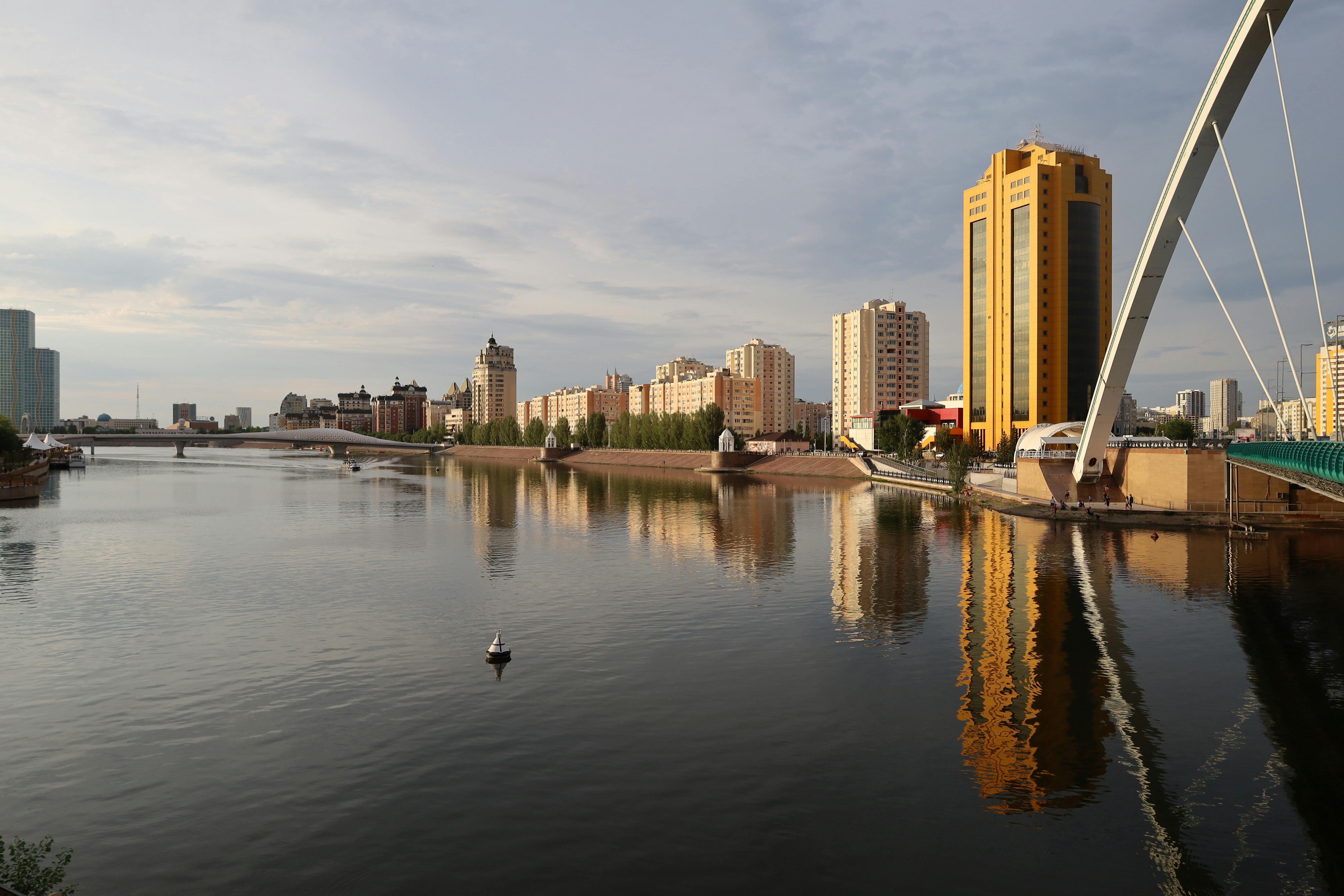 Concrete Buildings Near the Water · Free Stock Photo