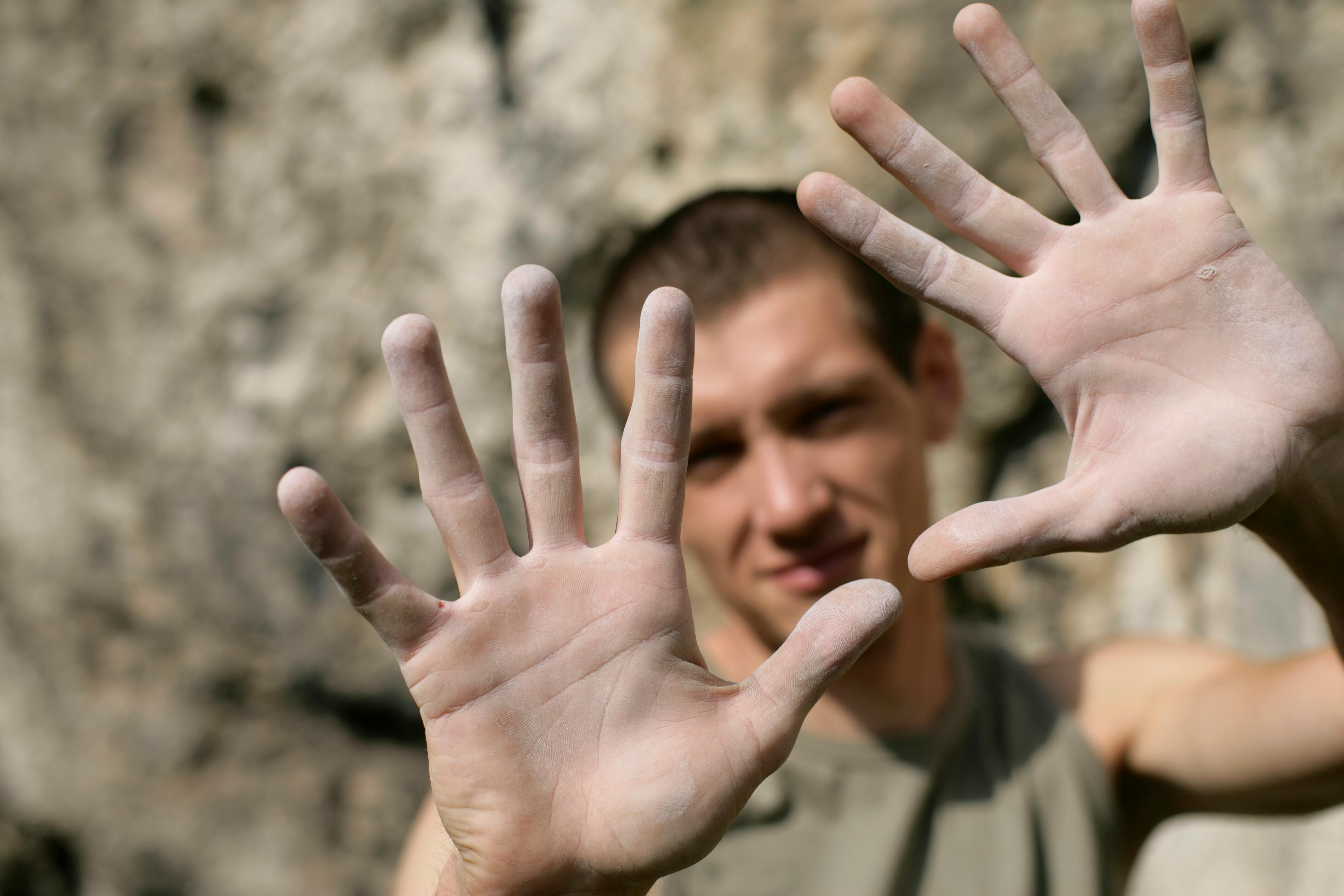 Close-Up Photograph of a Person's Crossed Hands · Free Stock Photo