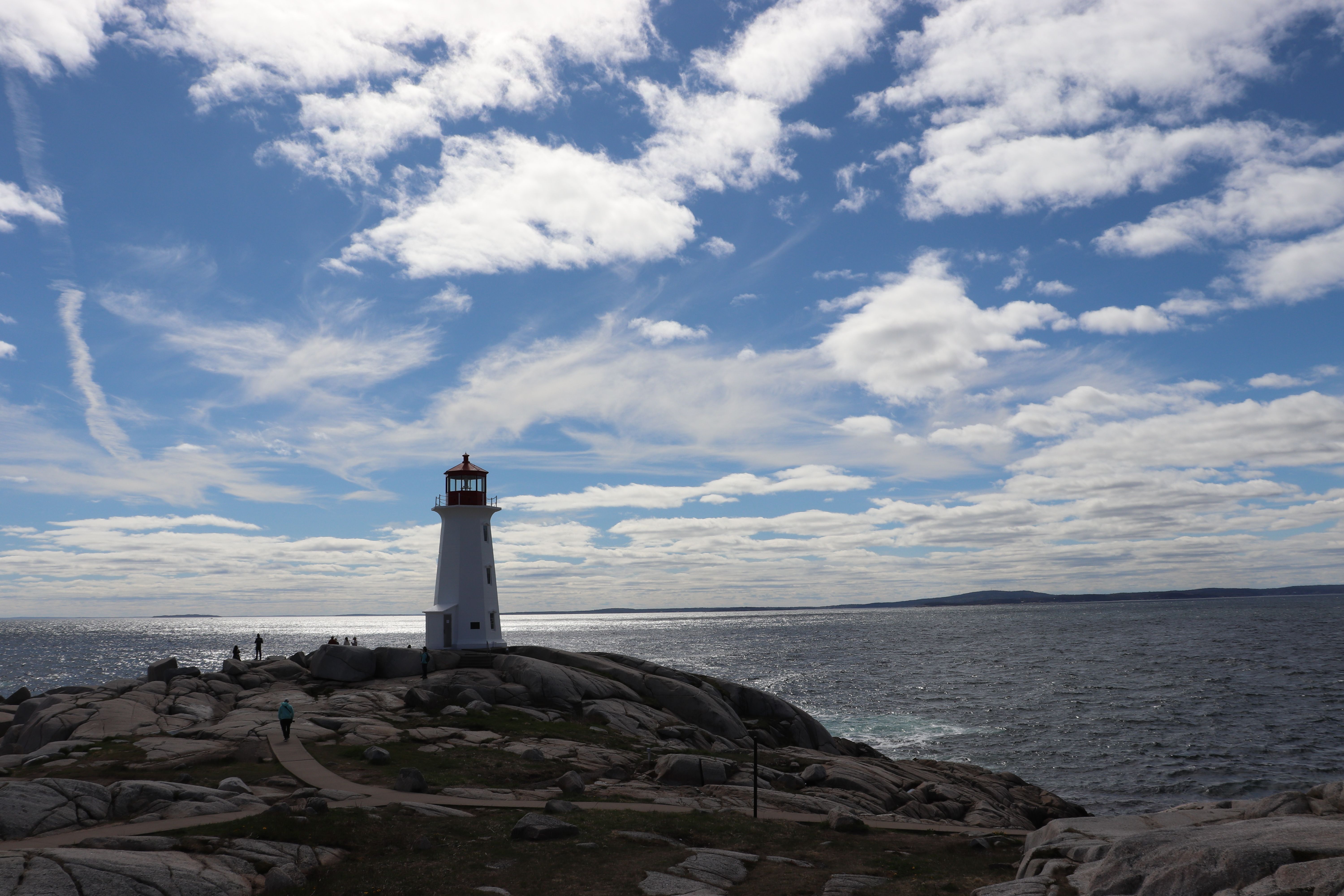 Red and White Lighthouse Tower Near a Coast · Free Stock Photo