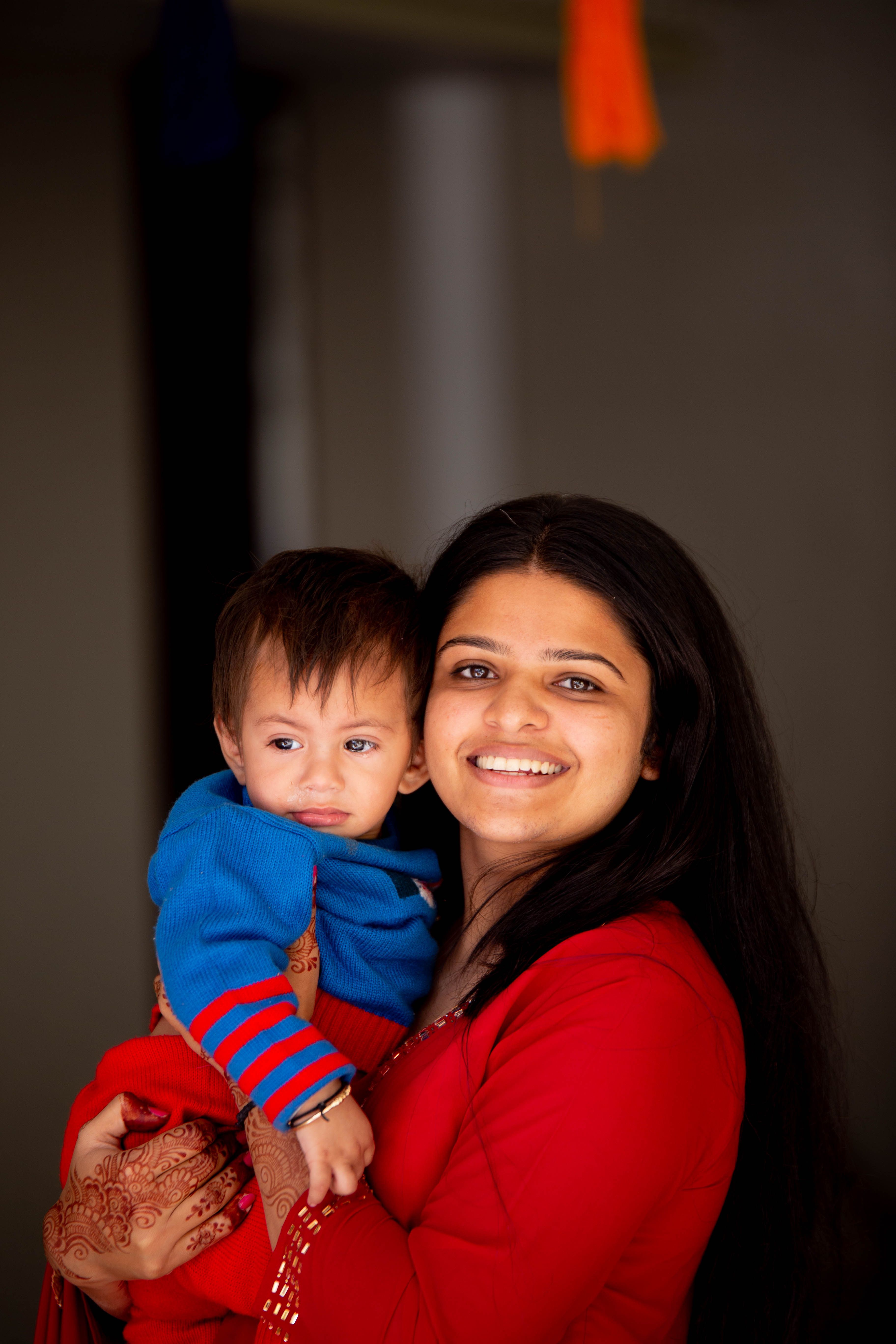 Smiling Mother Posing with Baby · Free Stock Photo