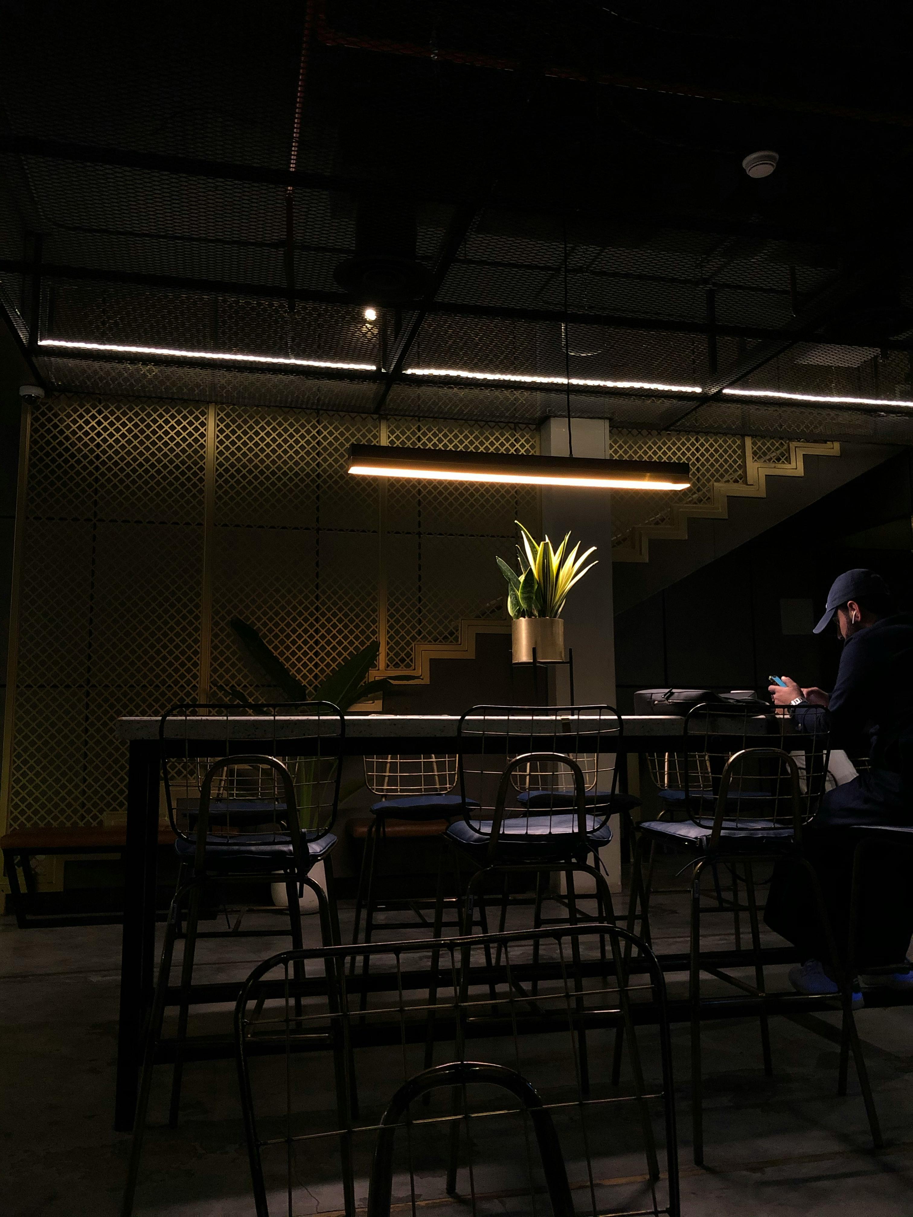 Man in Black Jacket Sitting on Chair · Free Stock Photo