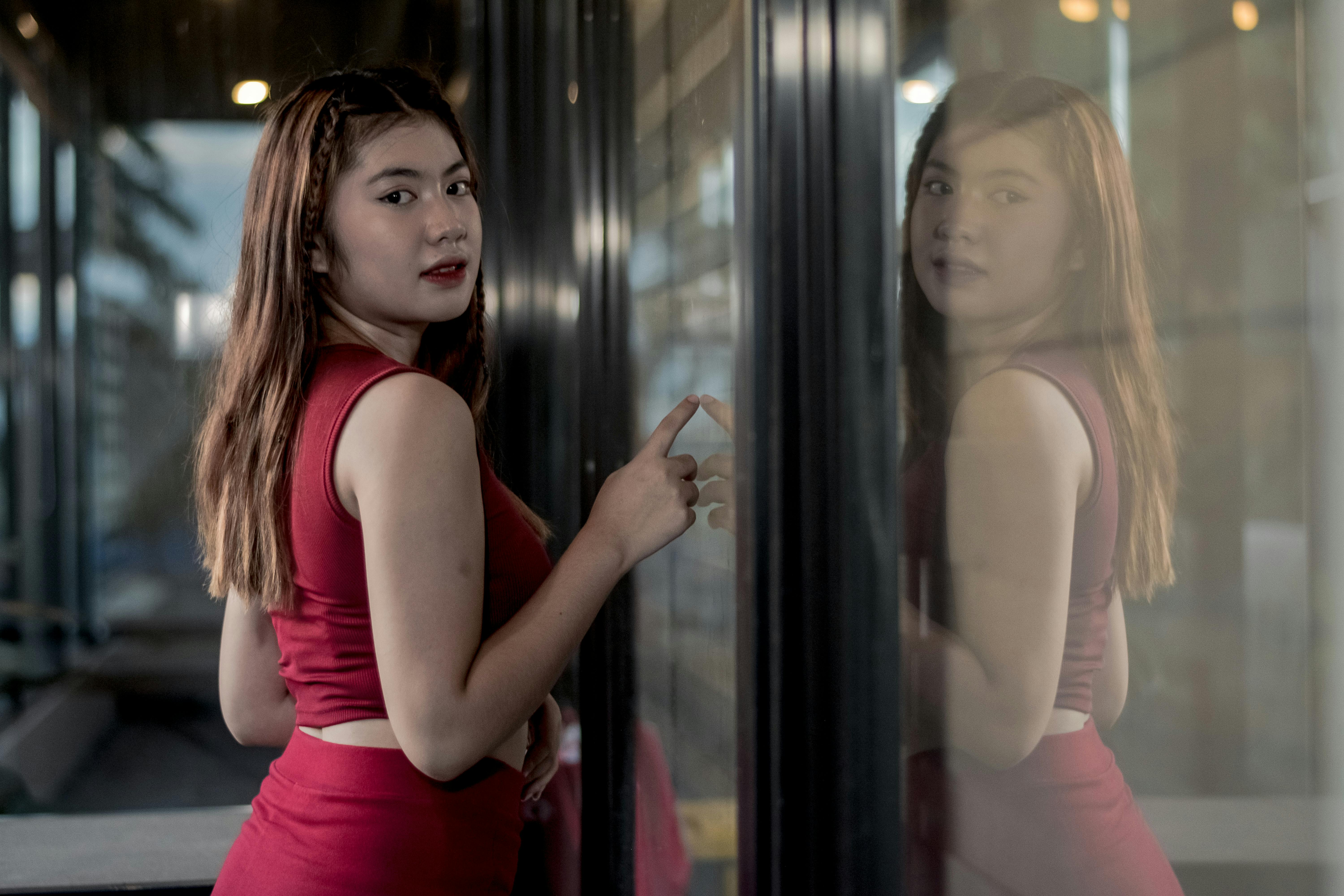 Woman in Dress Posing near Window · Free Stock Photo