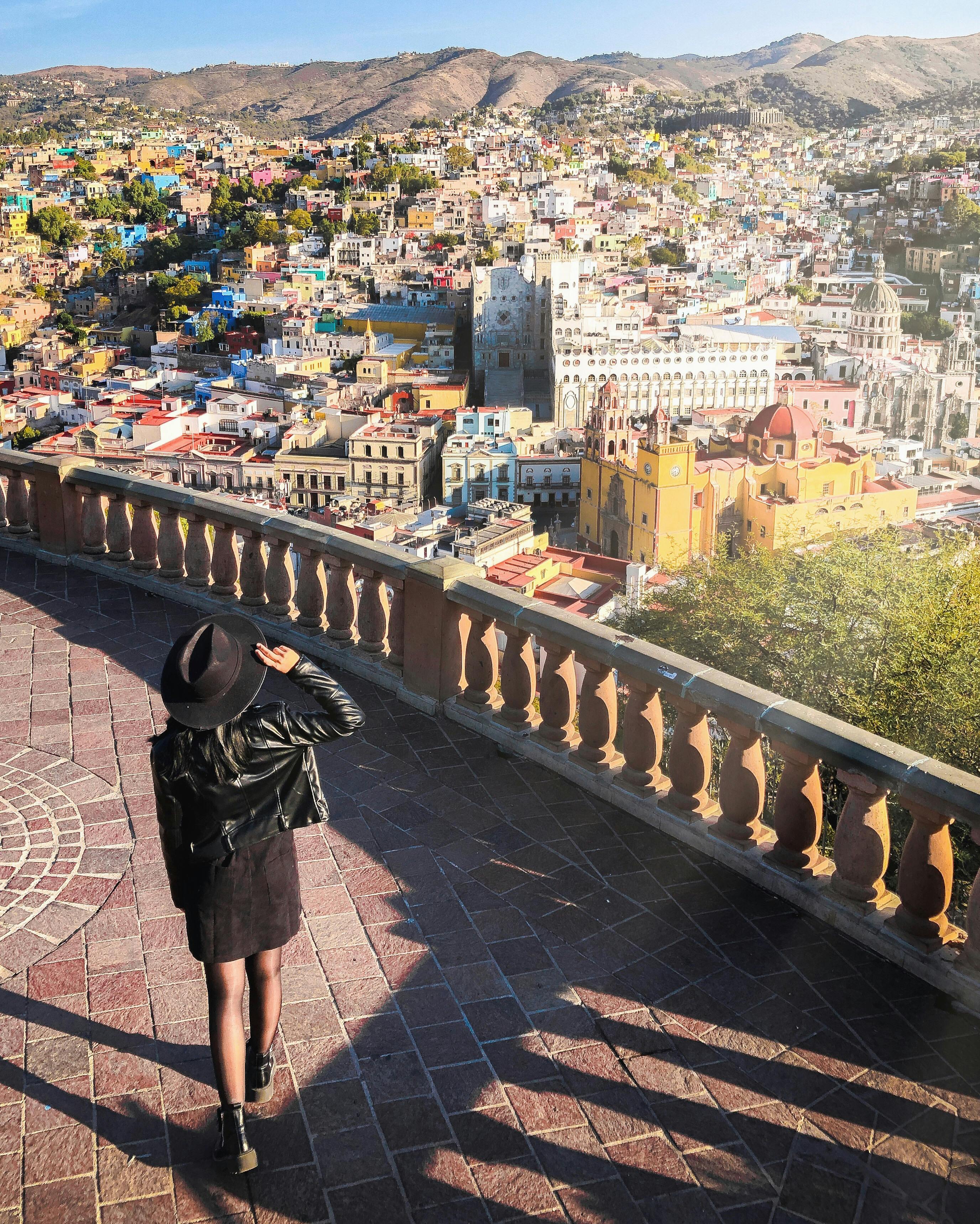 Side View Photo of Woman Sitting on Ground Overlooking a Hill · Free ...