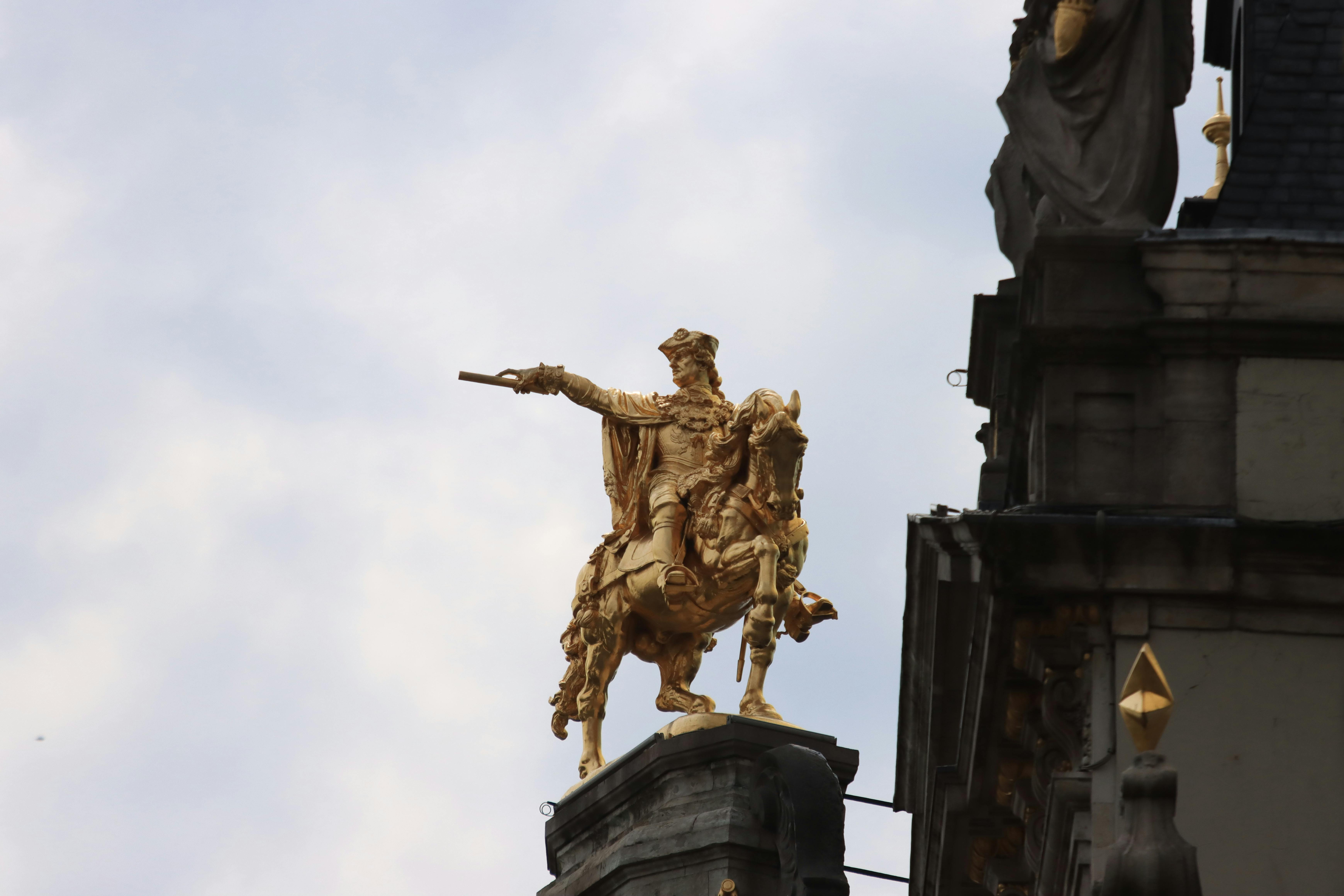 Man Holding a Sword Statue · Free Stock Photo
