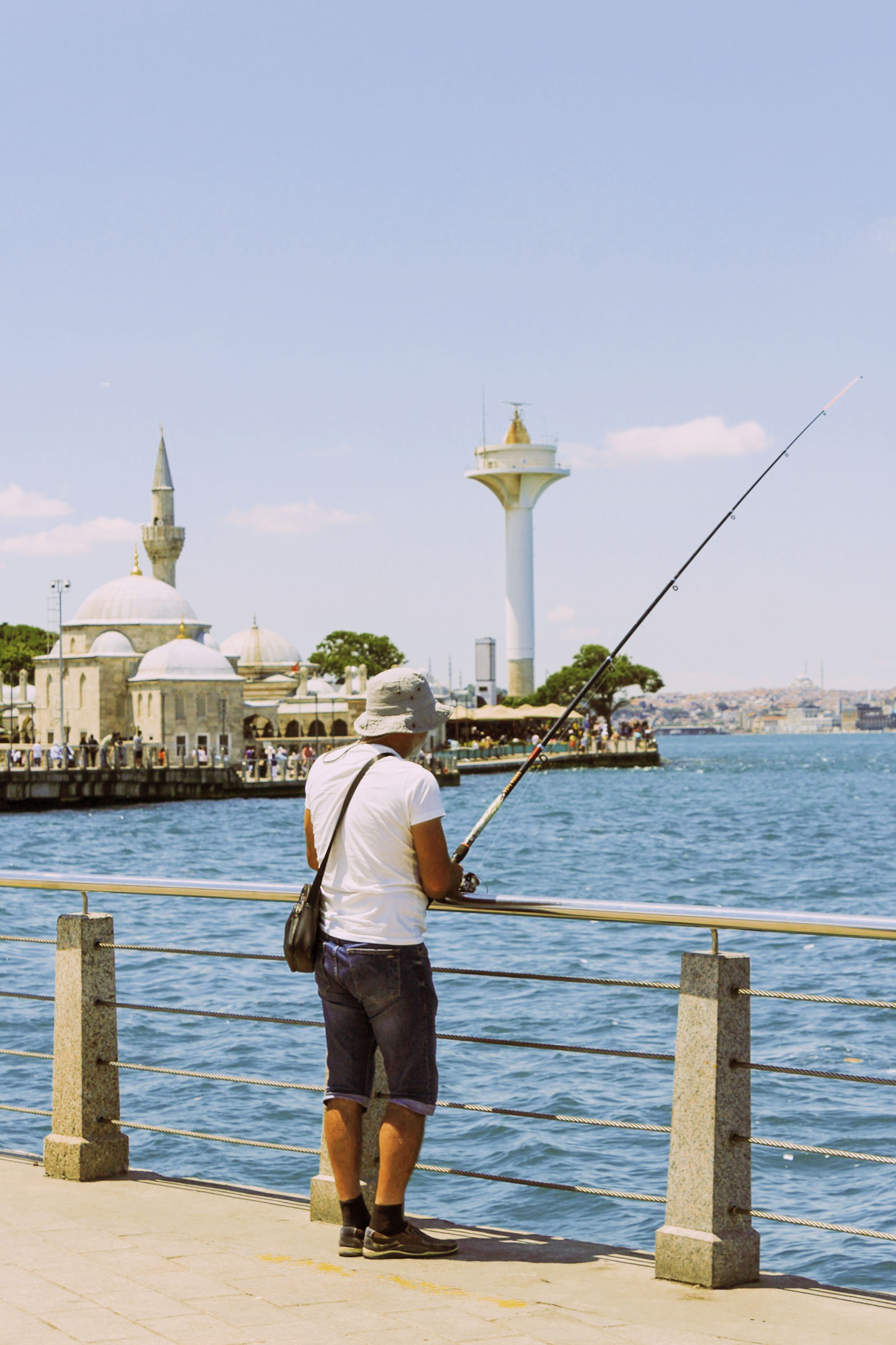 Man Fishing From Bridge · Free Stock Photo