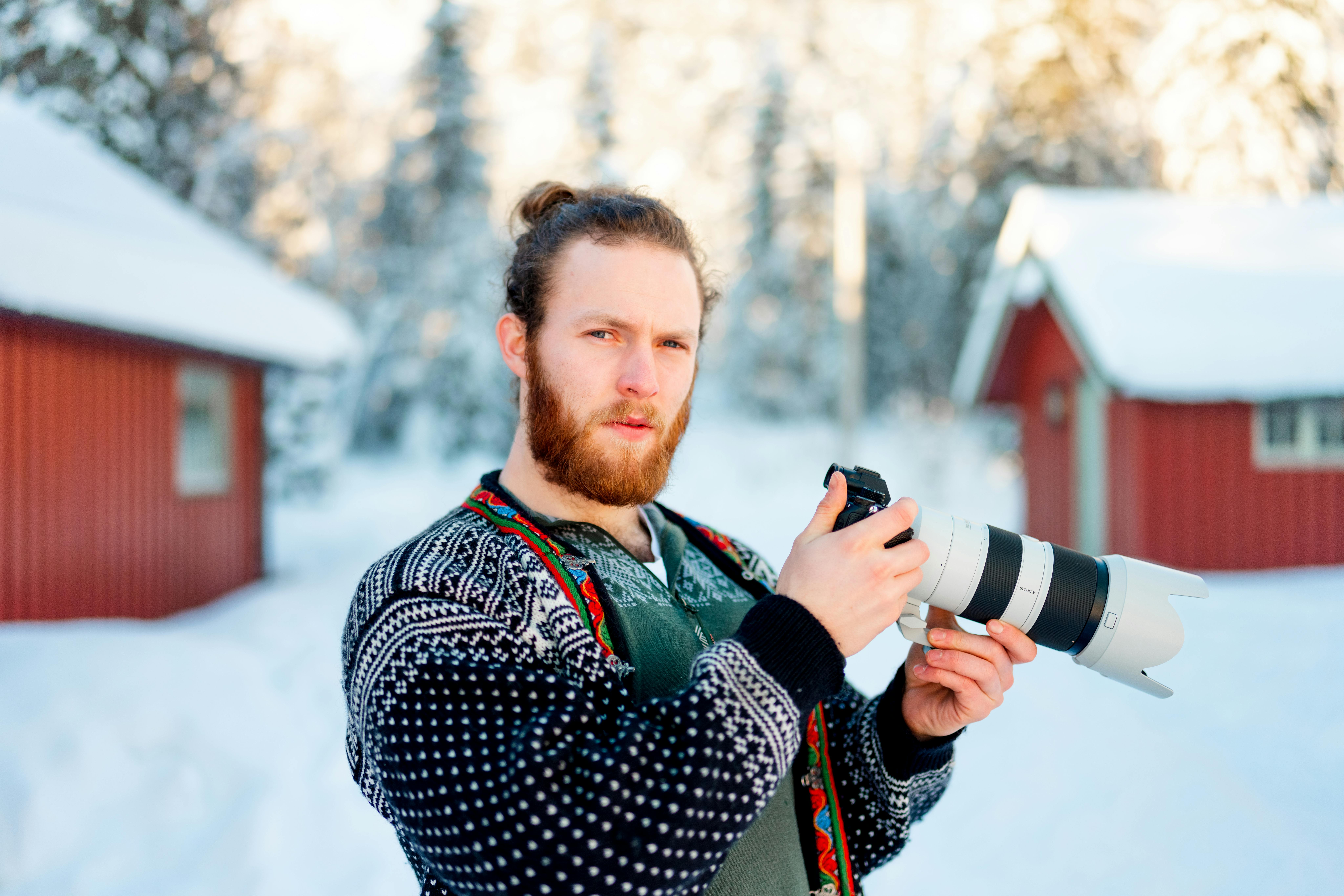 Bearded Man Holding a Camera · Free Stock Photo