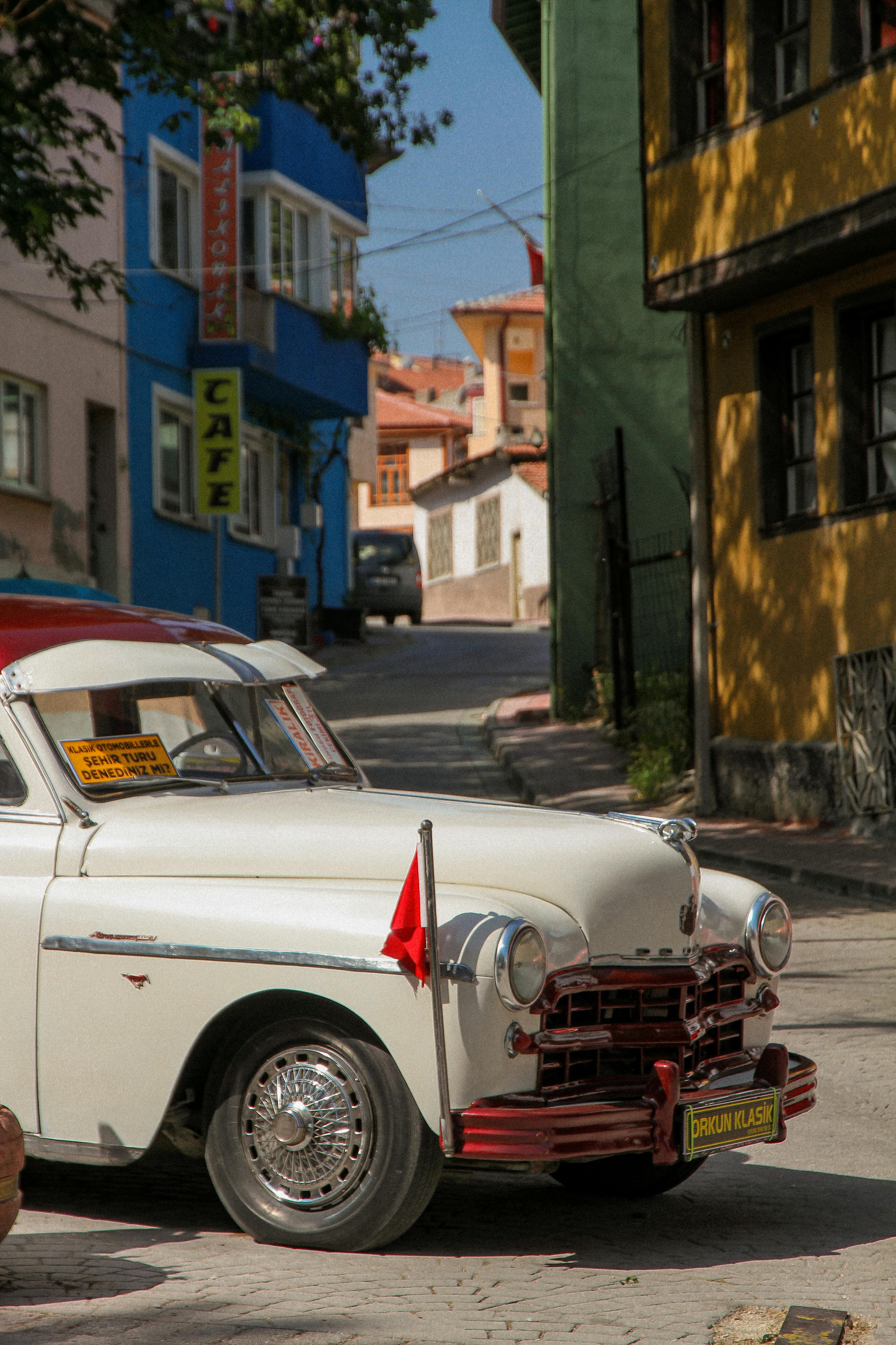 A White Car Moving on the Road · Free Stock Photo