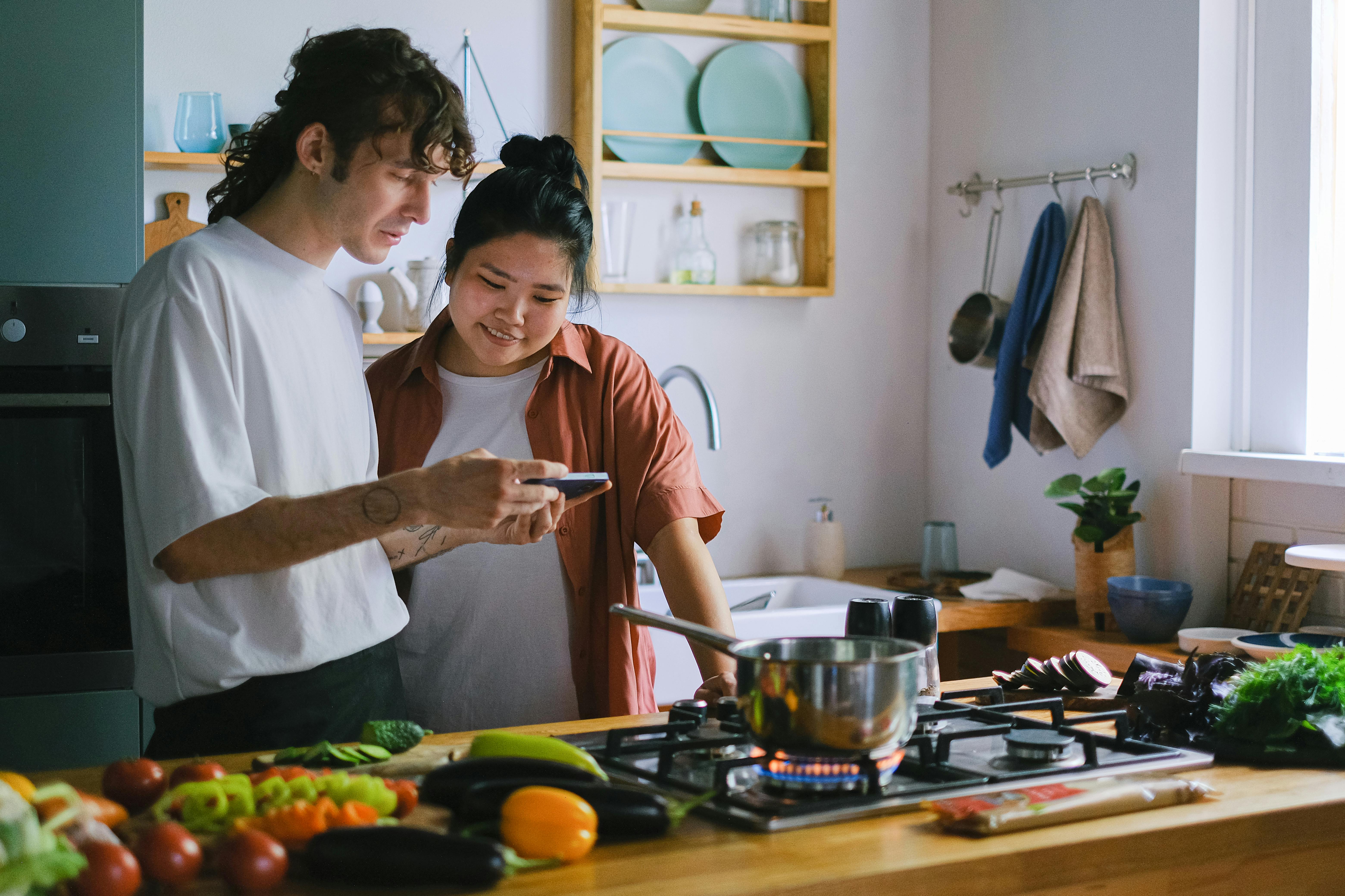 Couple Cooking Together in Modern Kitchen · Free Stock Photo