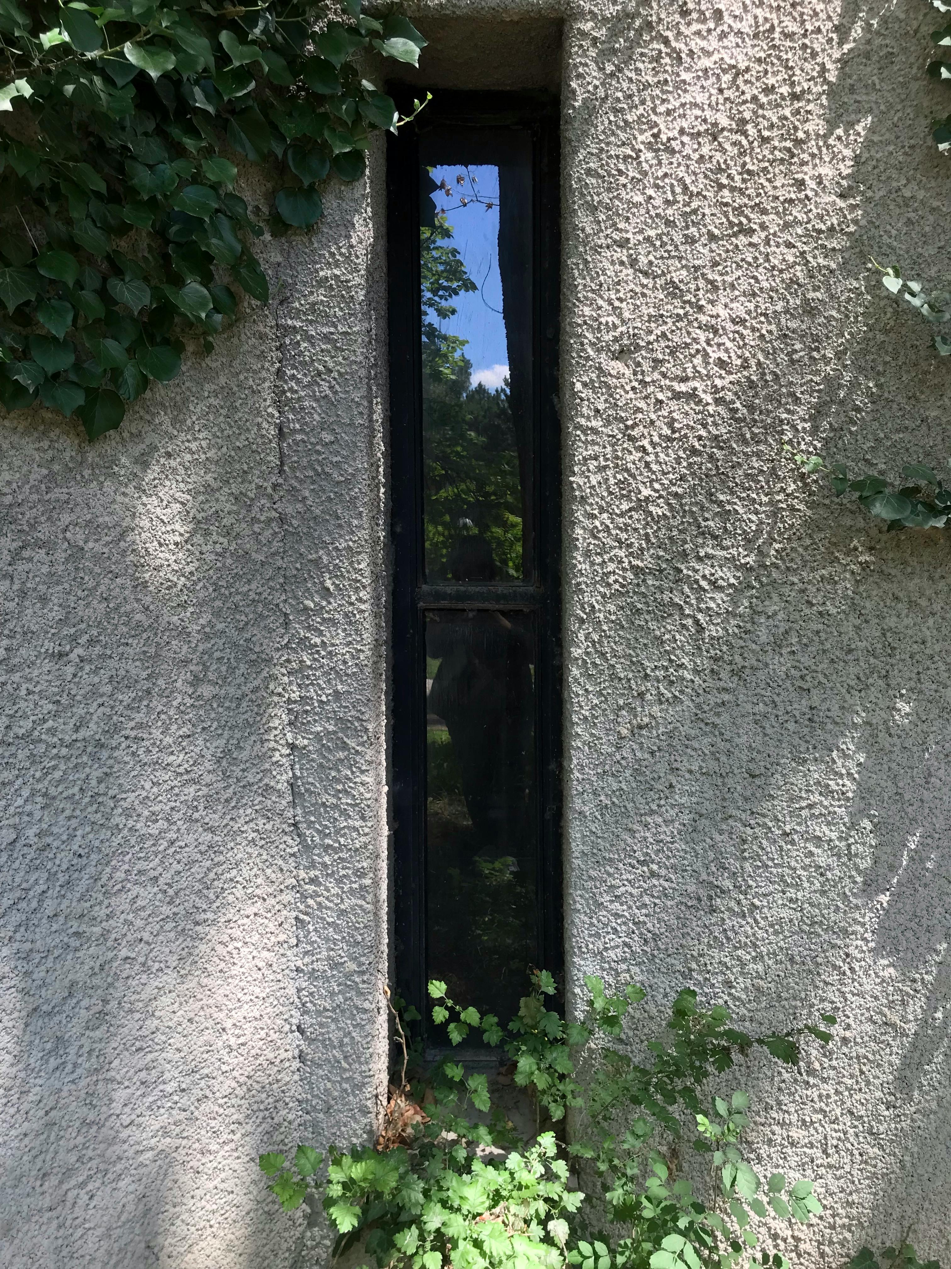 Glass Window on a Concrete Wall · Free Stock Photo