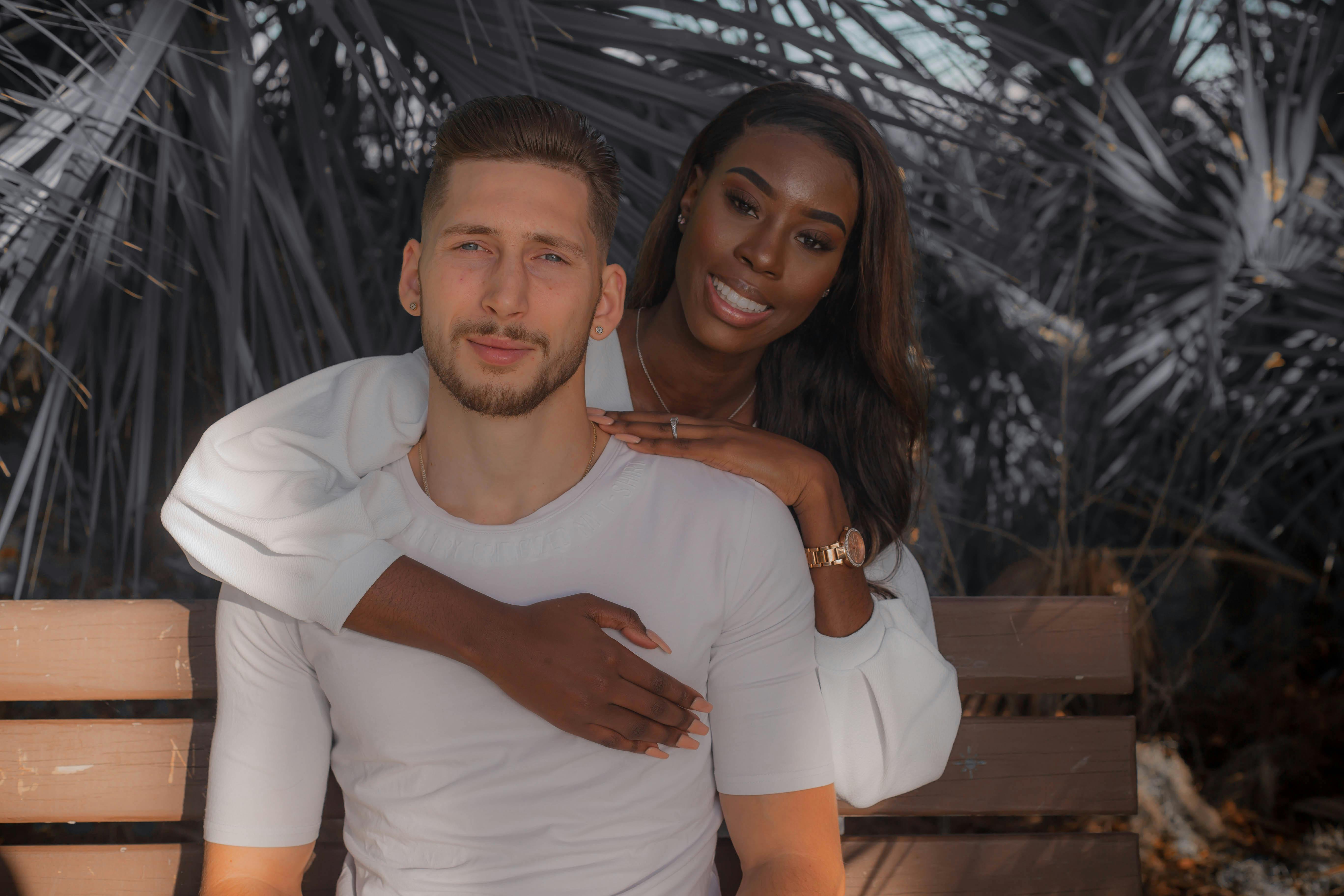 Couple Standing with Arms Around · Free Stock Photo