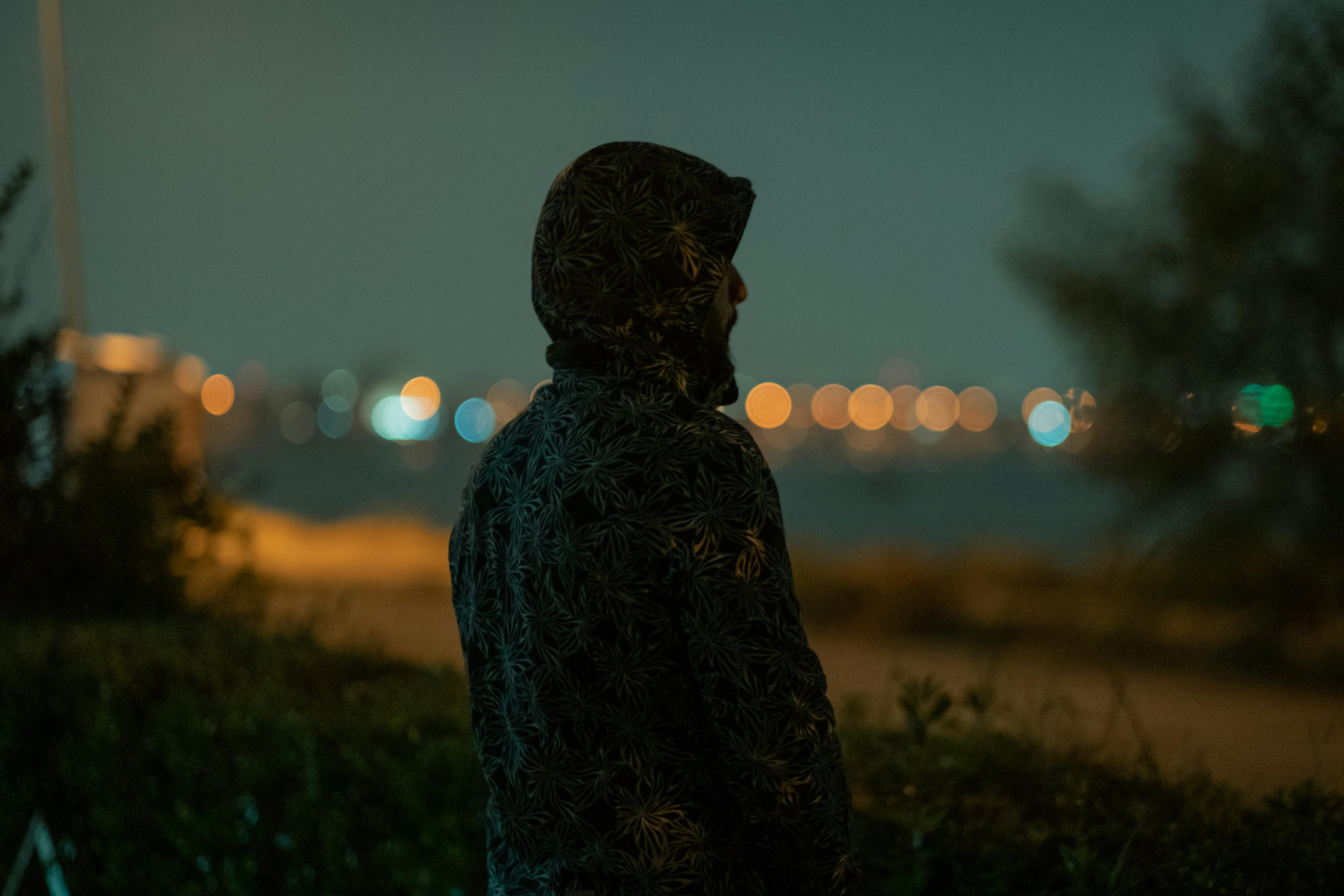 Man in Hoodie in Evening Darkness · Free Stock Photo