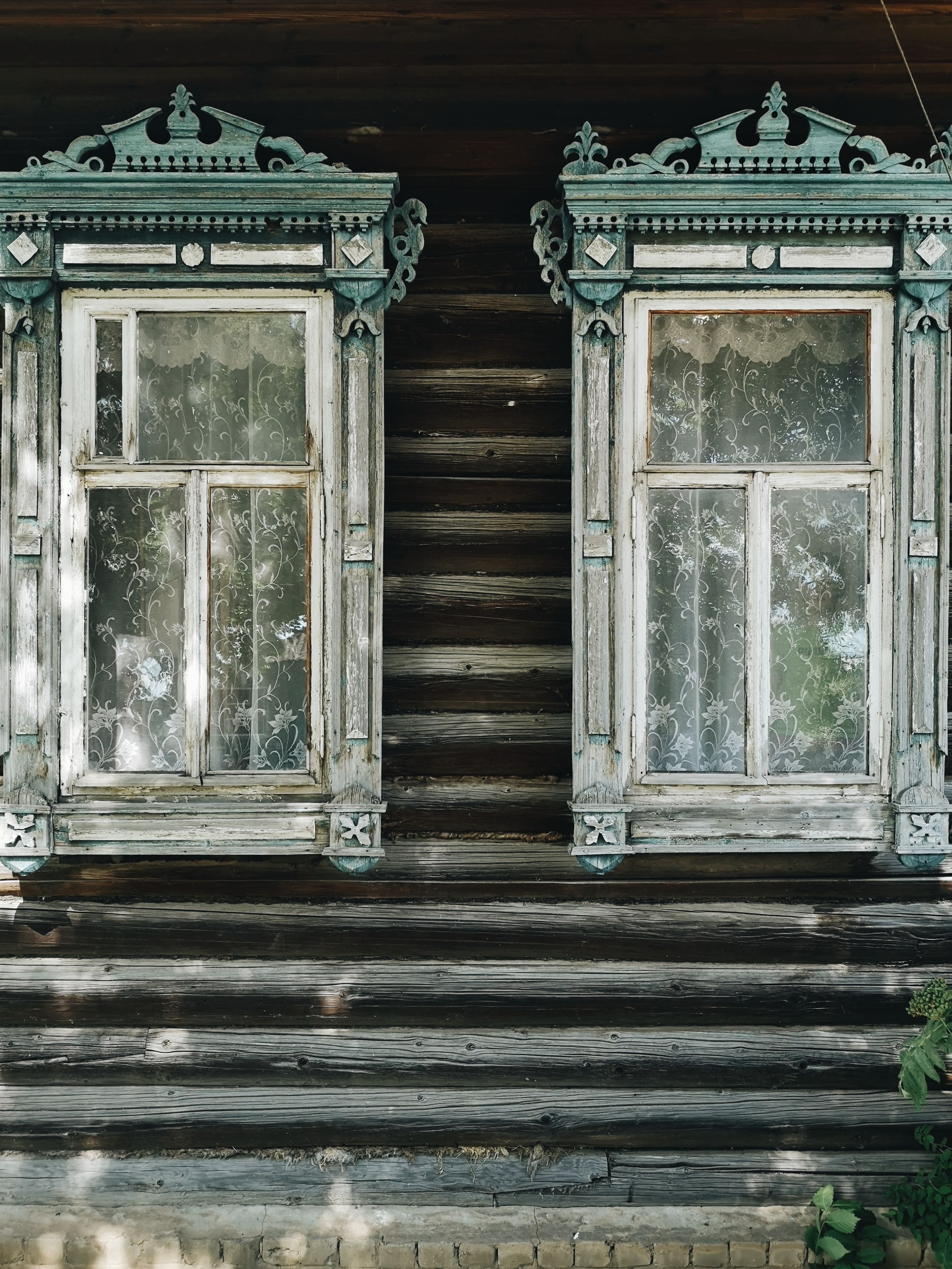 Symmetrical View of an Old Wooden House with Ornamental Window Frames ...