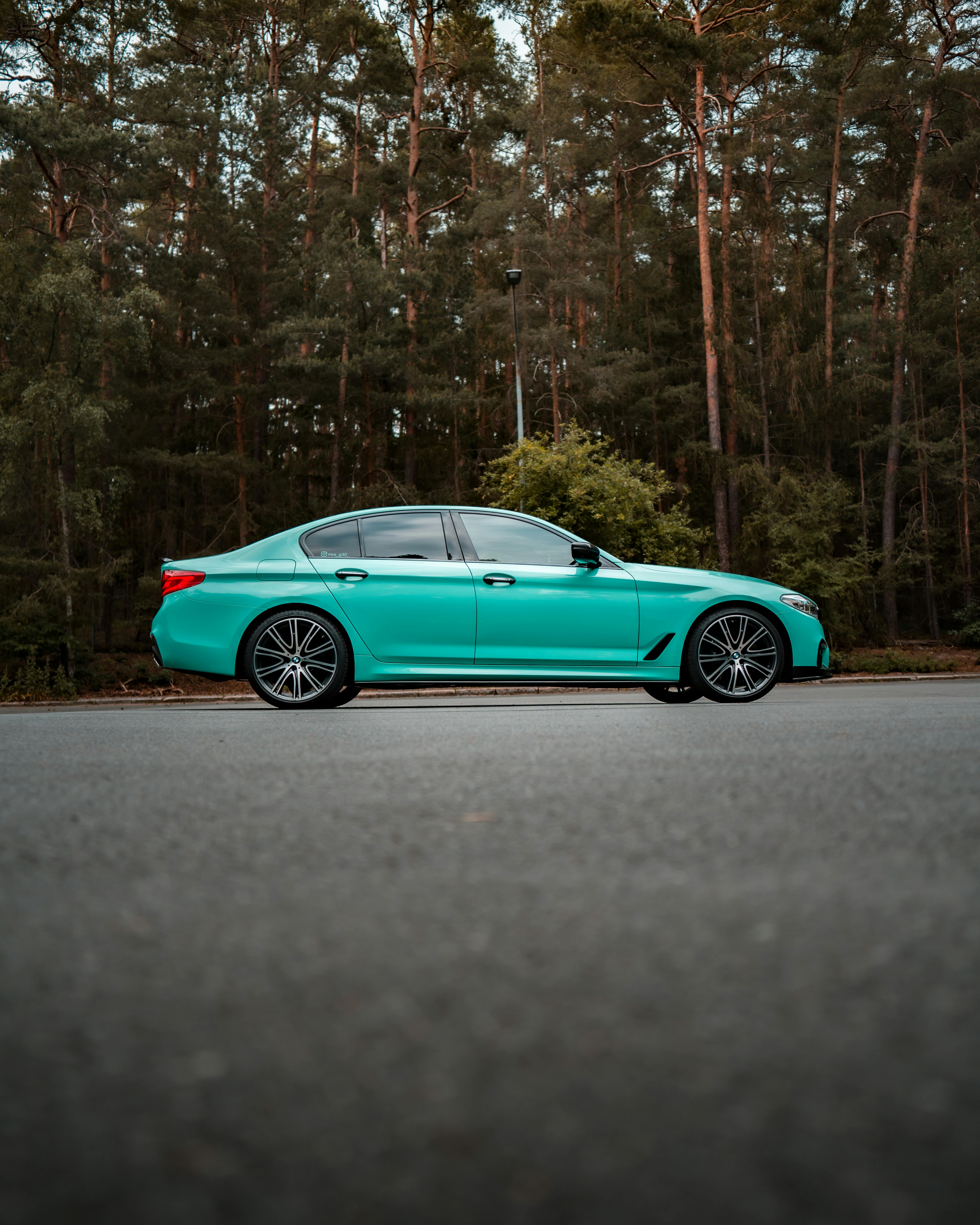 A Sedan Car Parked on the Road · Free Stock Photo