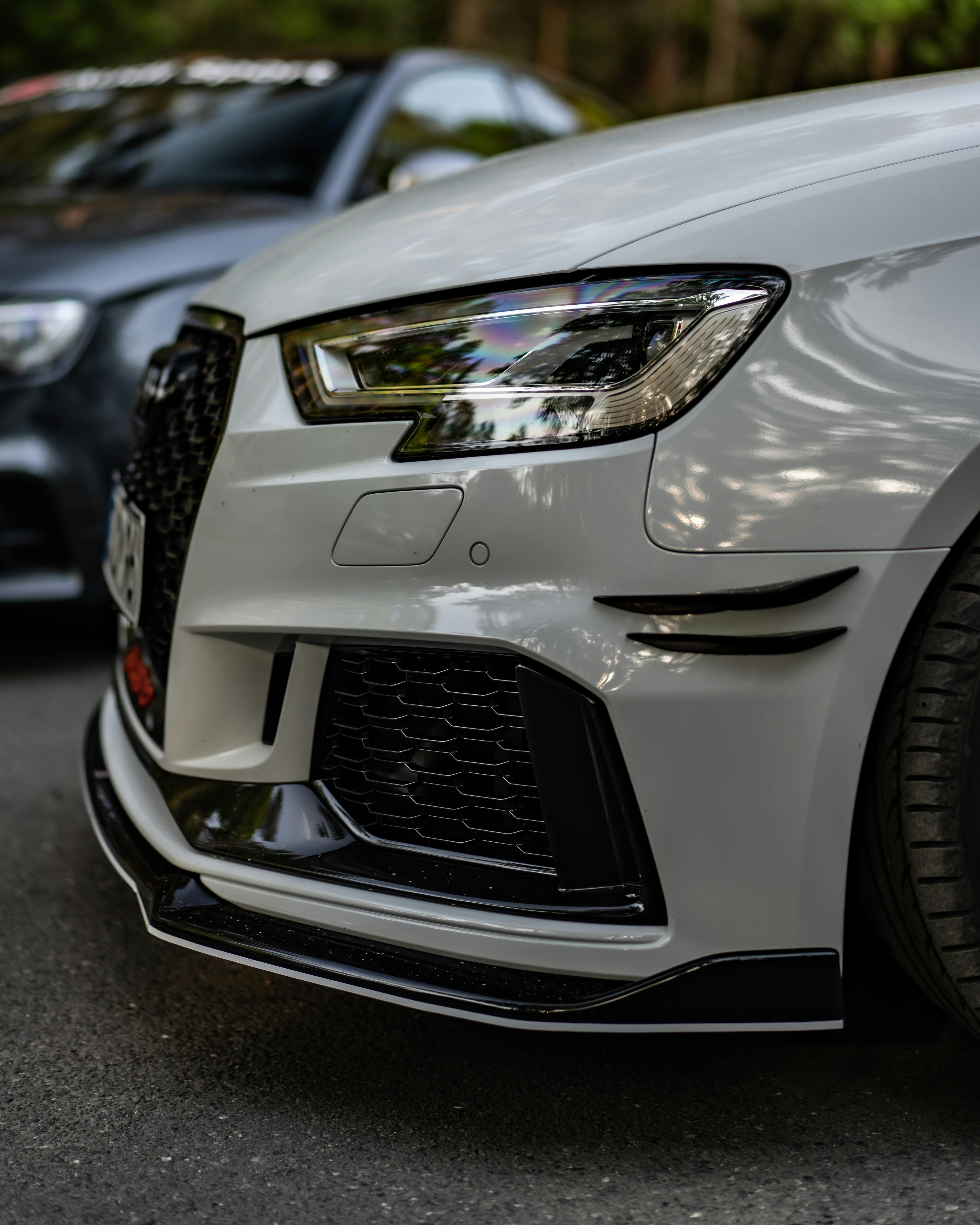 Open Headlight of Black Car · Free Stock Photo