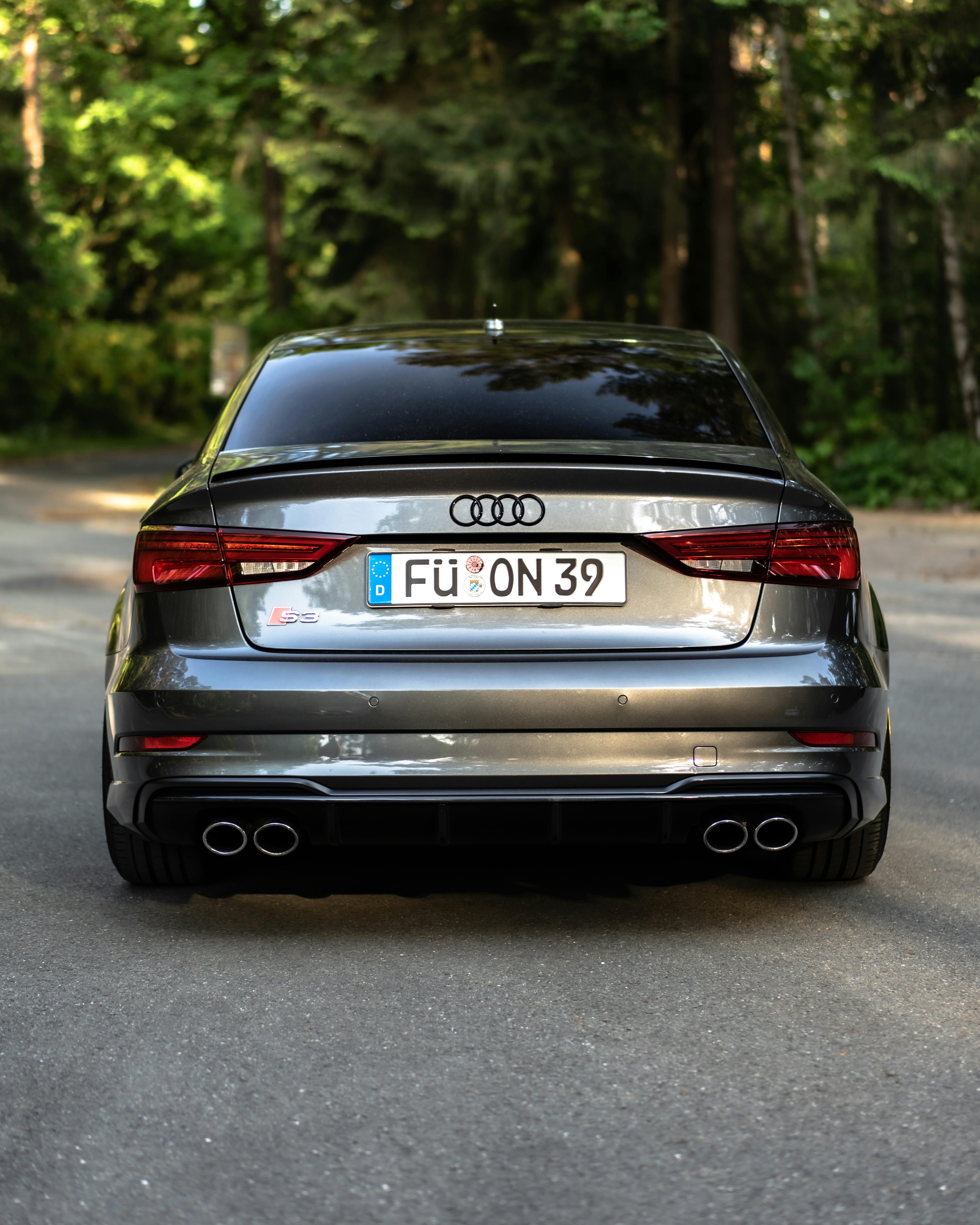 Back View Shot of an Audi Car Parked on the Road · Free Stock Photo