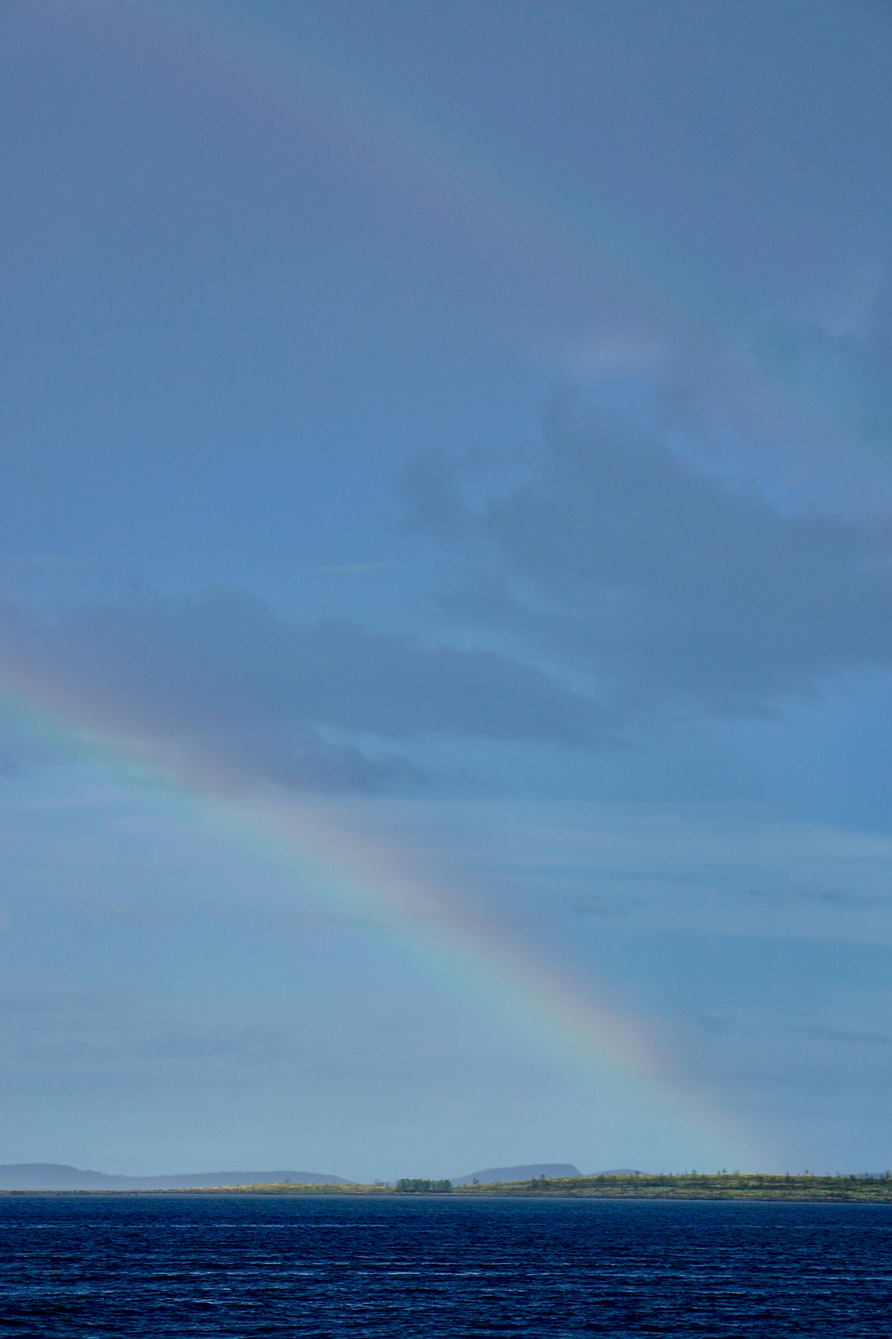 A Beautiful Rainbow Under Blue Sky · Free Stock Photo