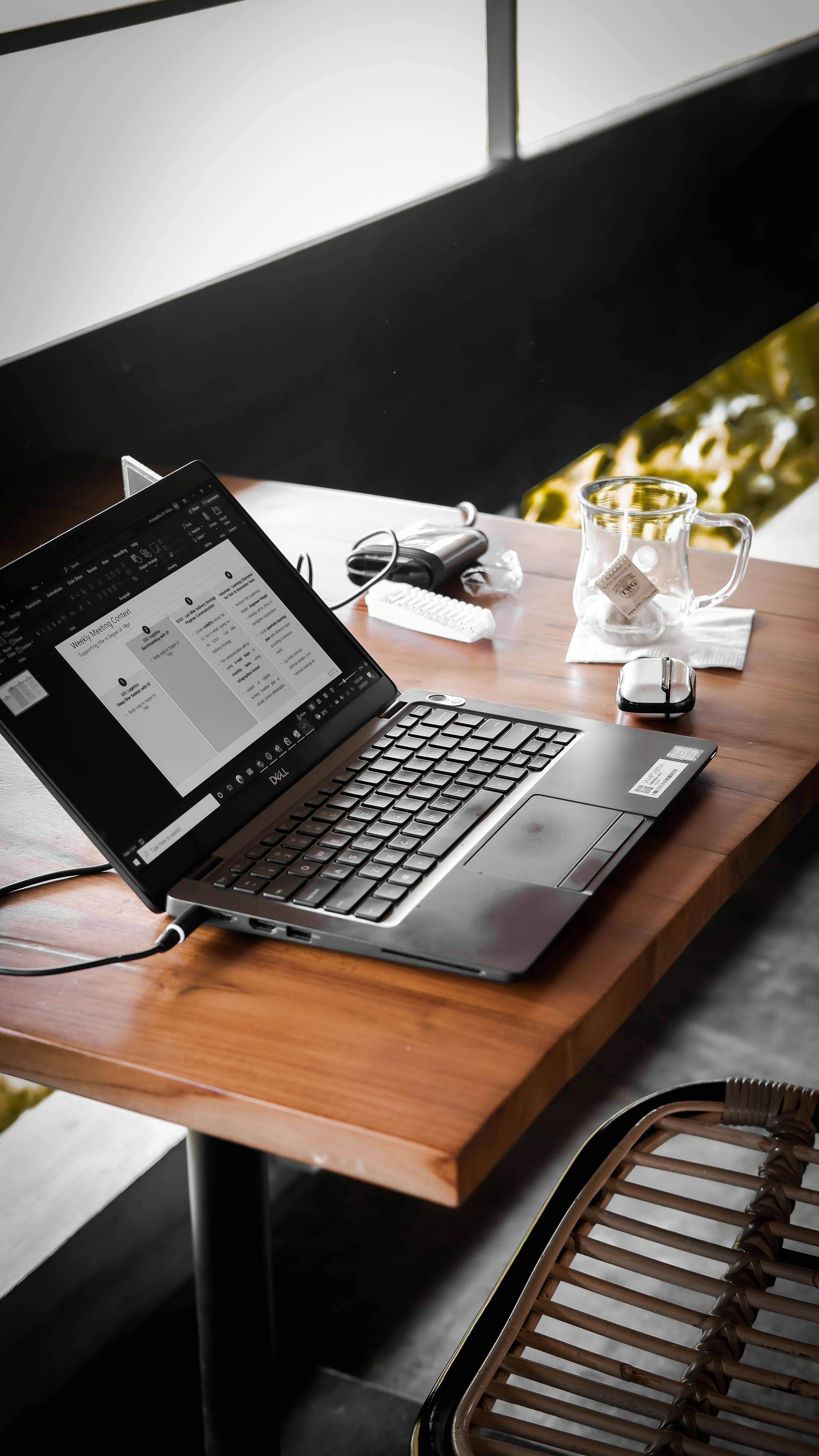 Open Laptop Lying on Coffee Table · Free Stock Photo