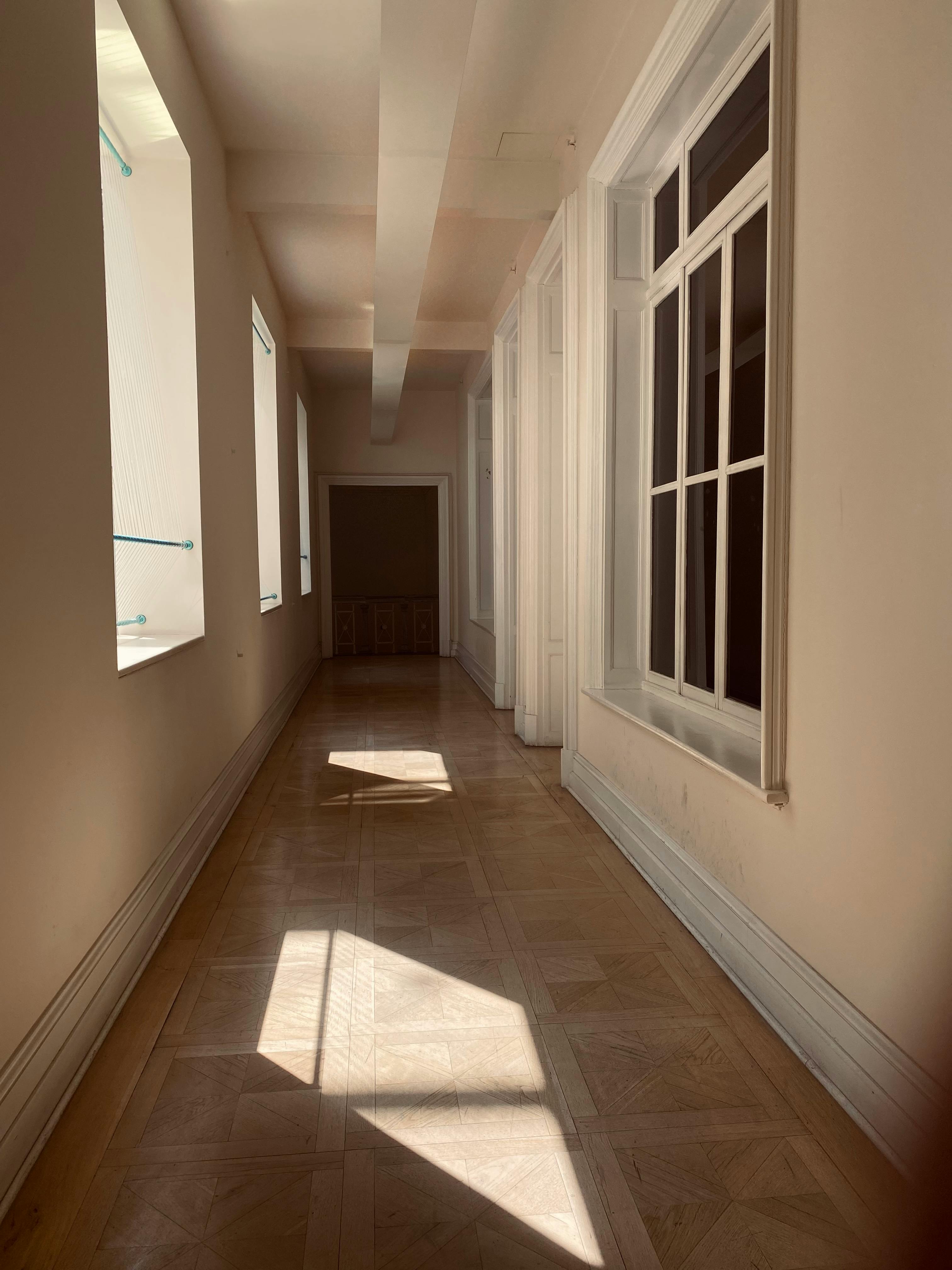 Empty Hallway Illuminated by Sunlight · Free Stock Photo