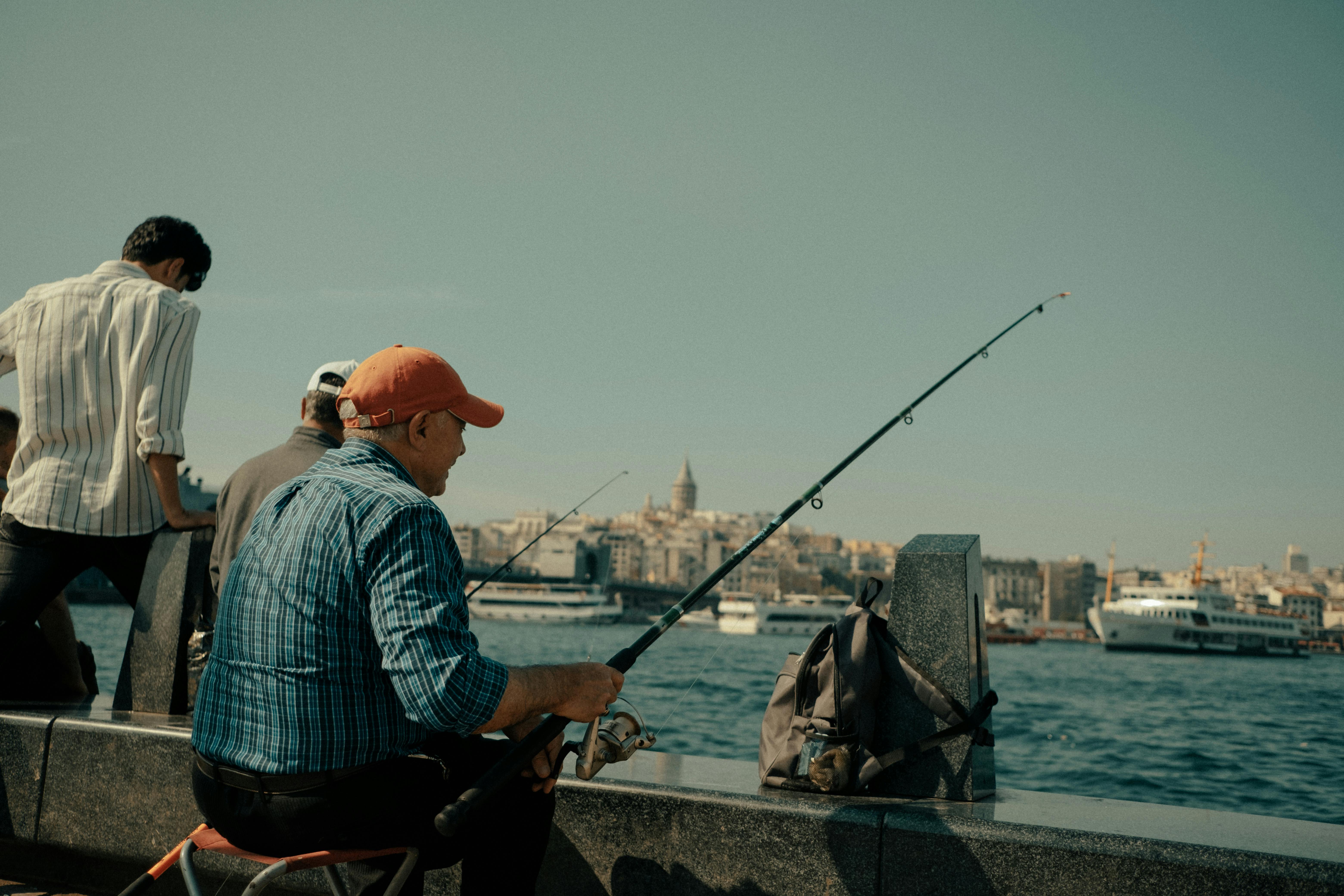 Photo of a Man Holding Fishing Rod · Free Stock Photo