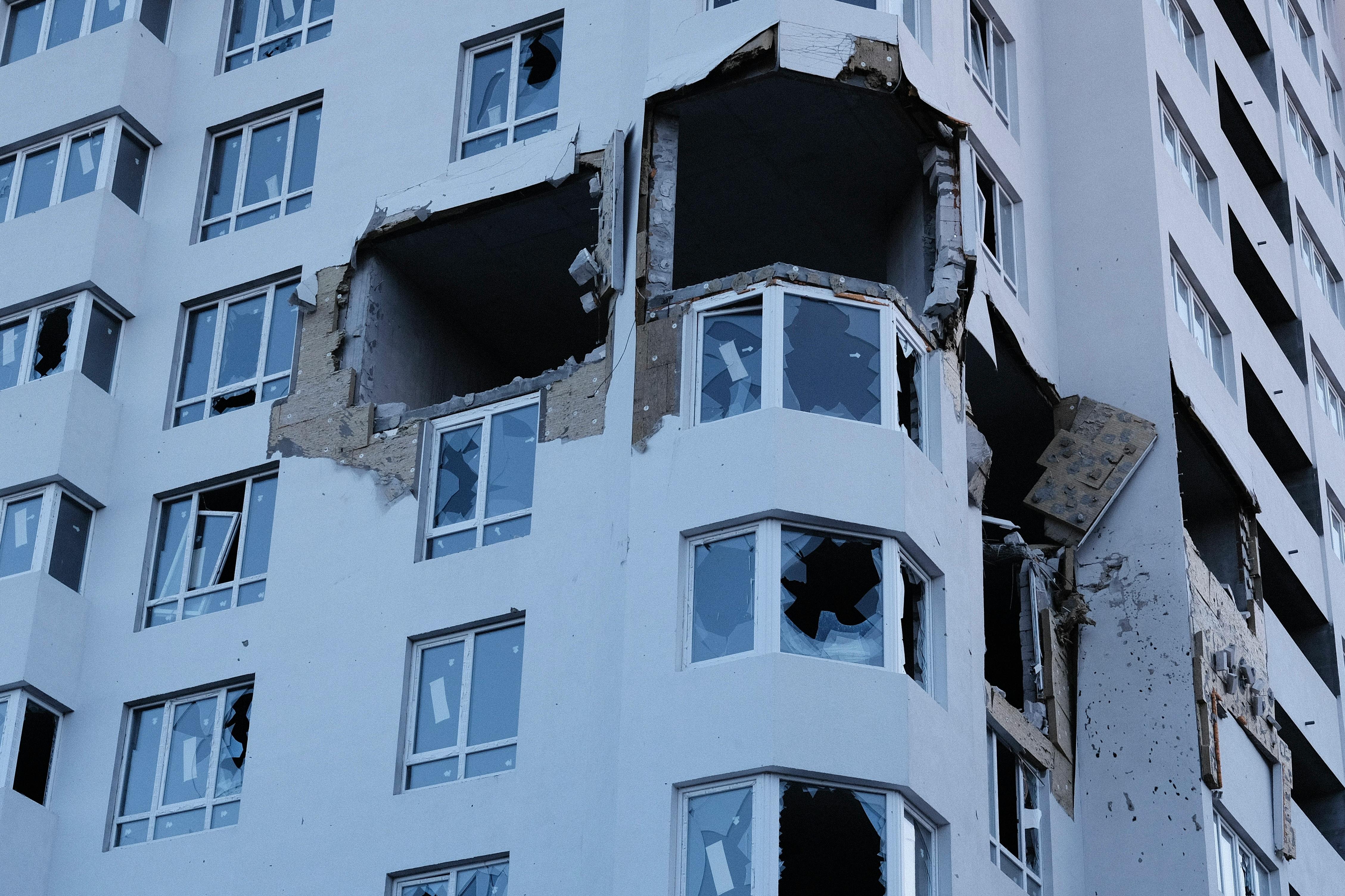 Damaged Building with Hole after Artillery Fire · Free Stock Photo