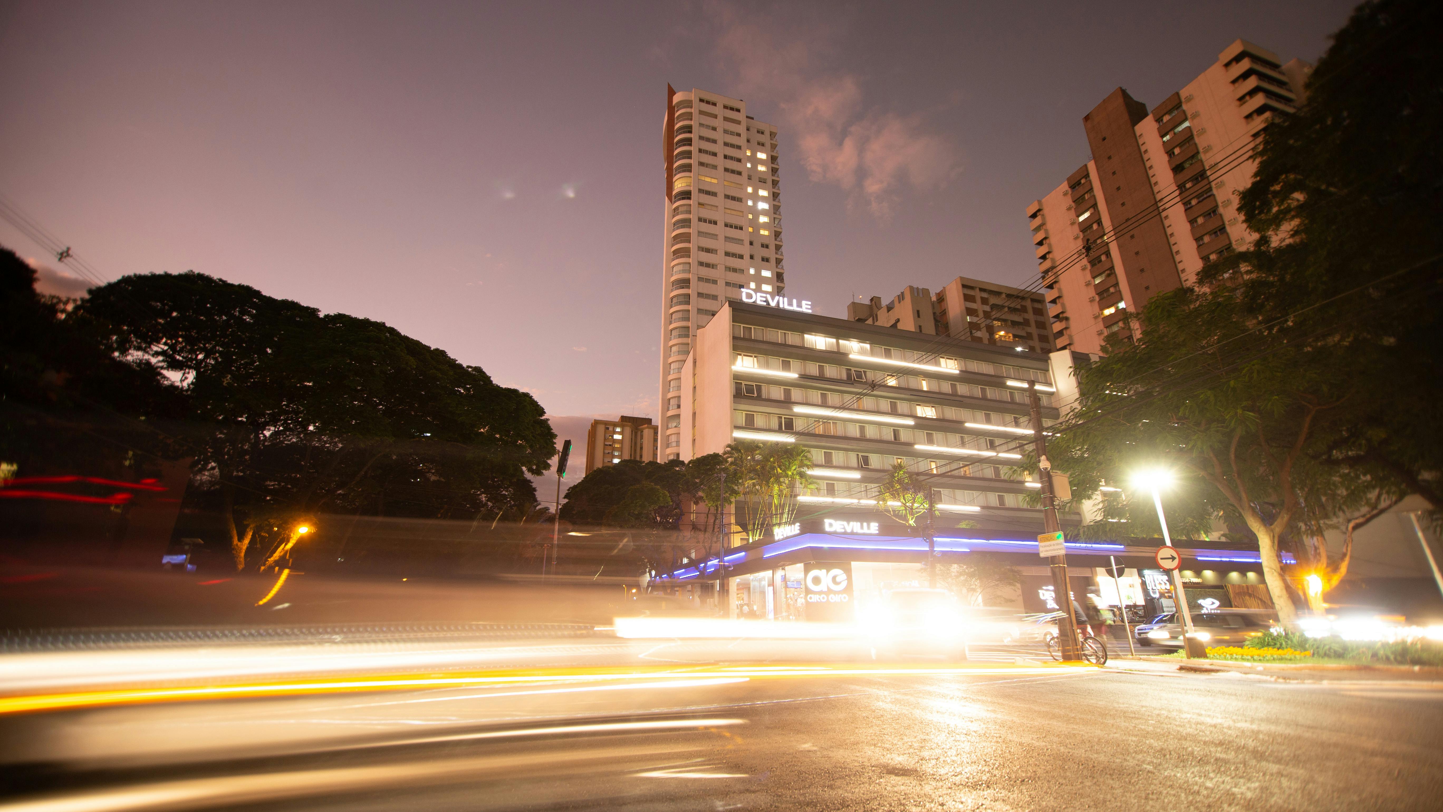 Black Canon Dslr Camera Behind Clear Highball Glass · Free Stock Photo