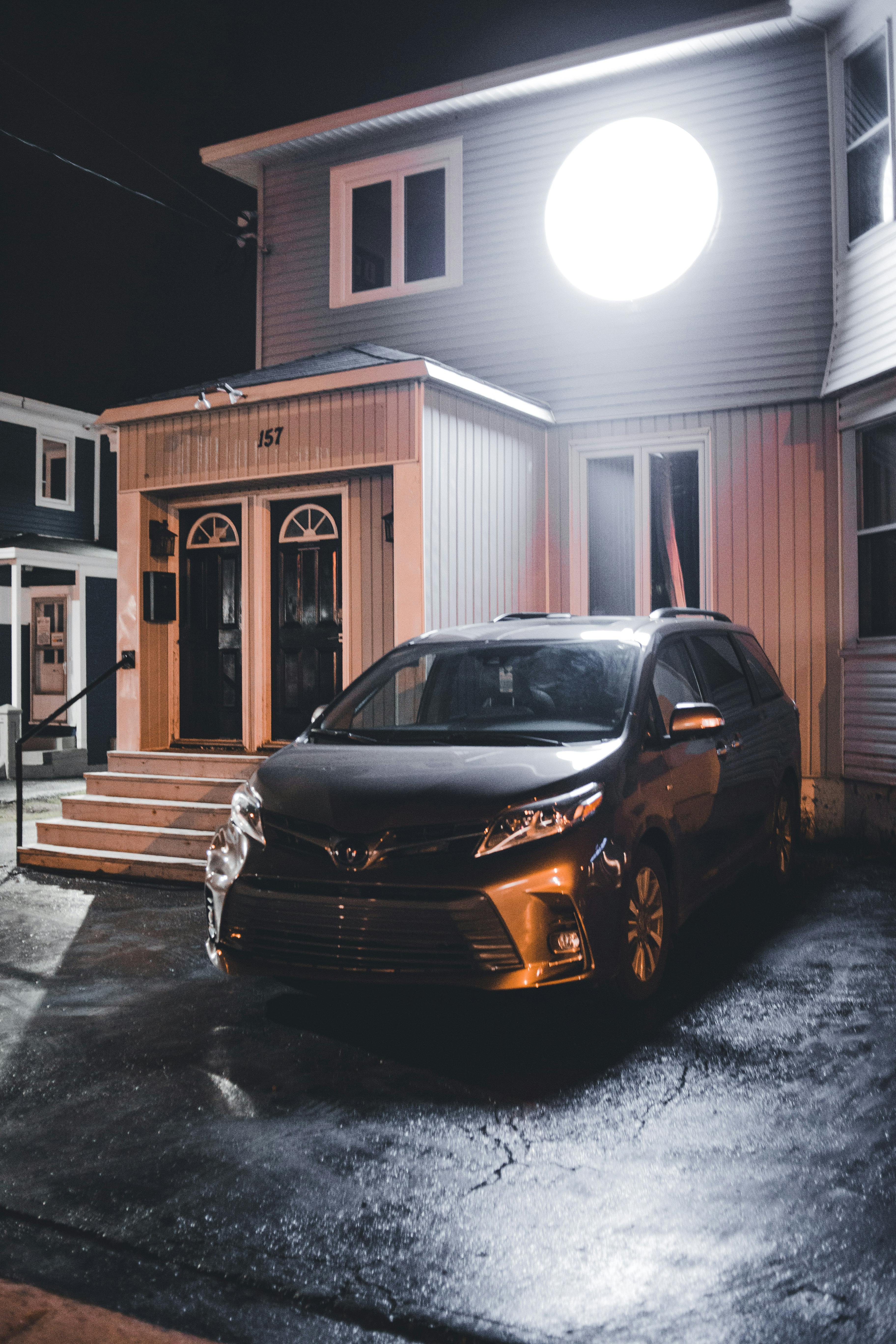 Car near Wooden House at Night · Free Stock Photo