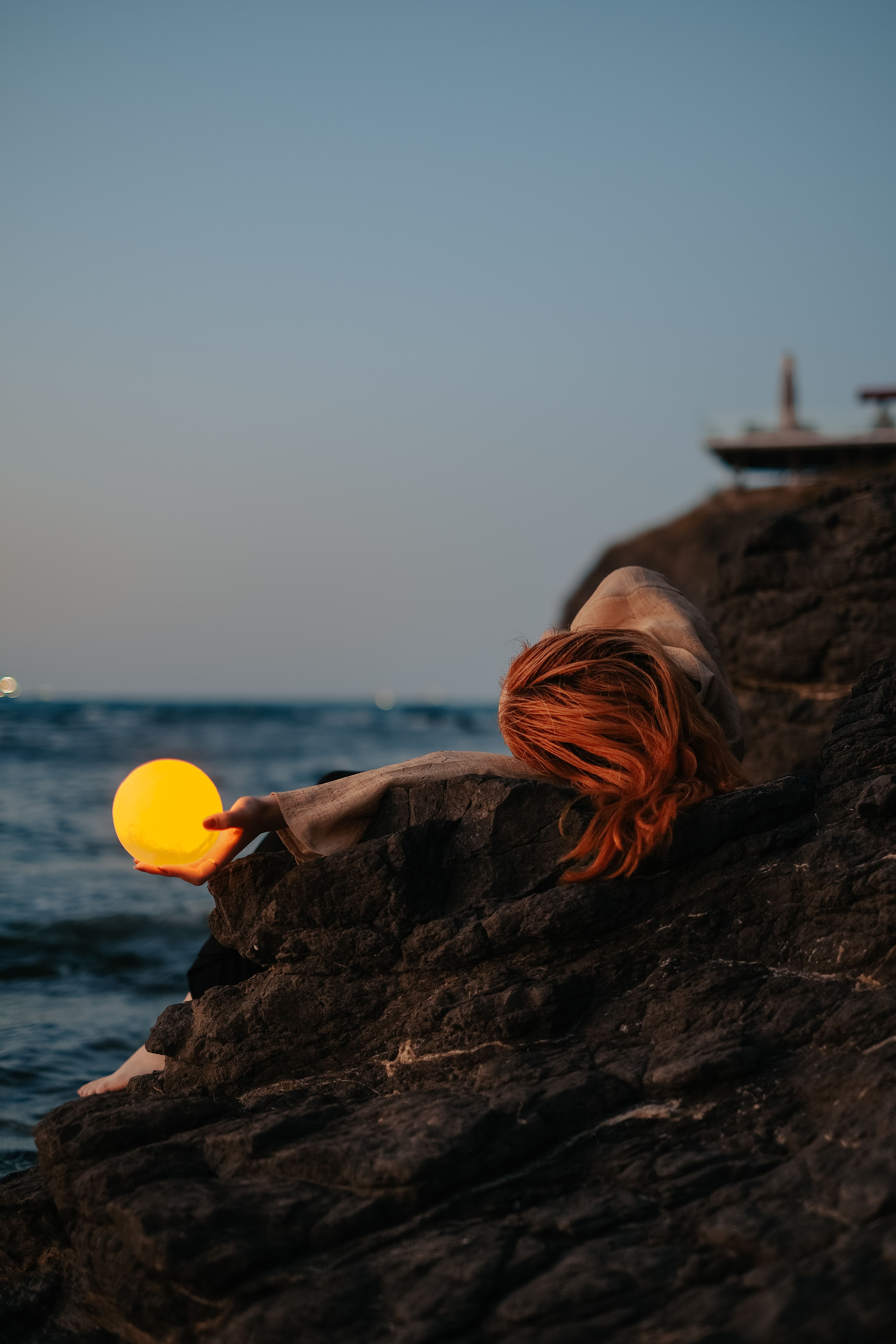 Woman with Light Ball on Sea Shore · Free Stock Photo