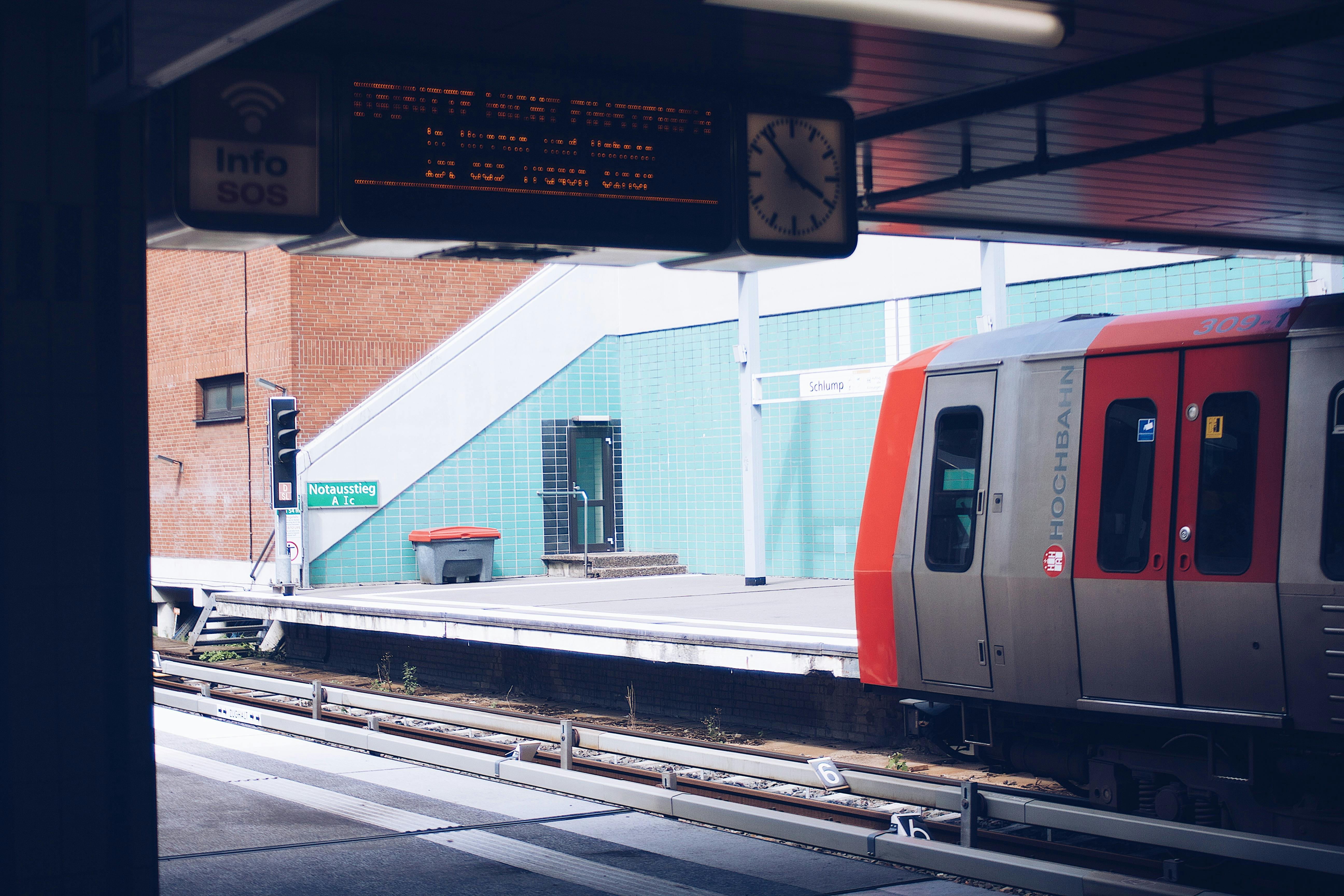 Red and Gray Train on Rail Road · Free Stock Photo