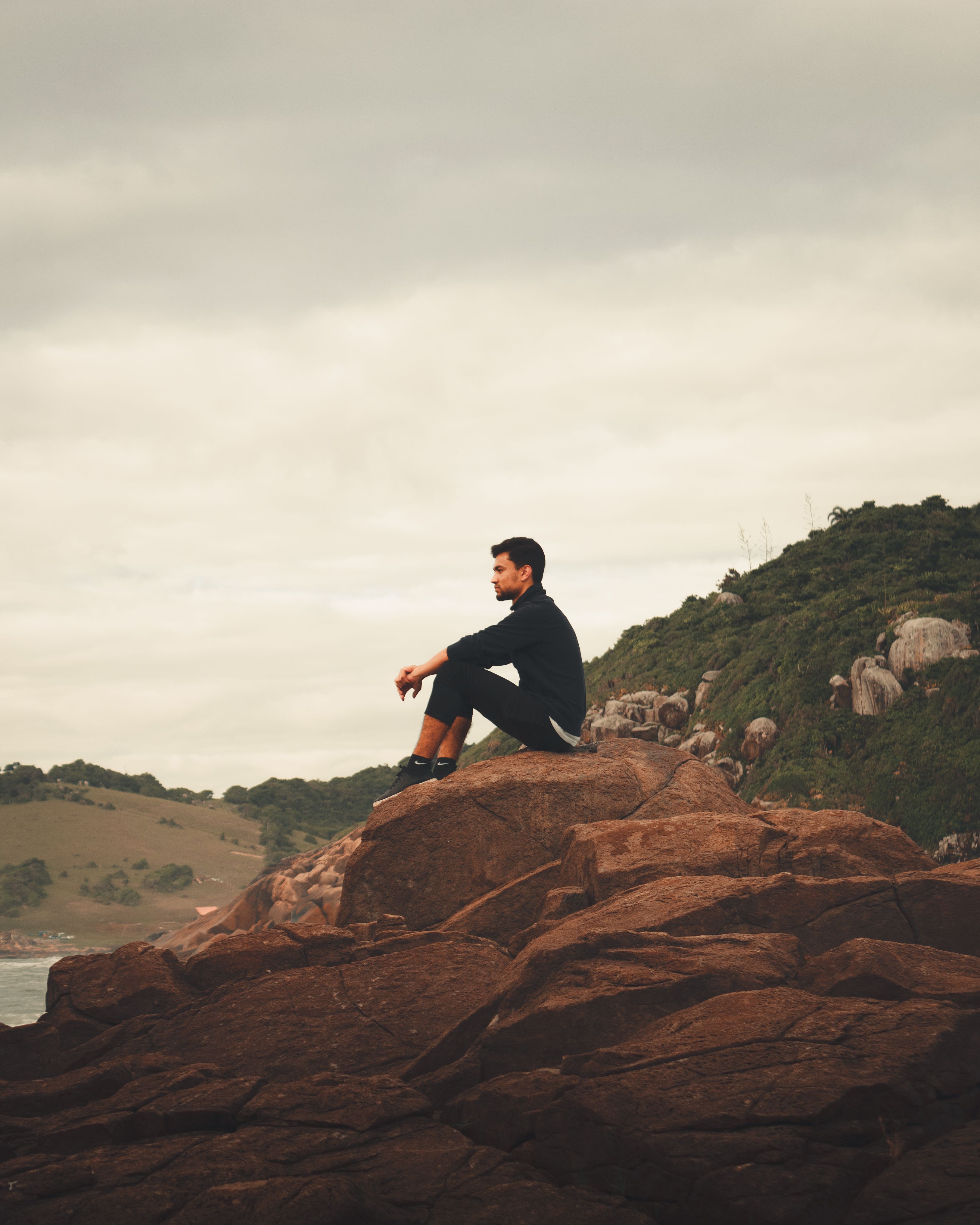 A Man Sitting on the Rock · Free Stock Photo