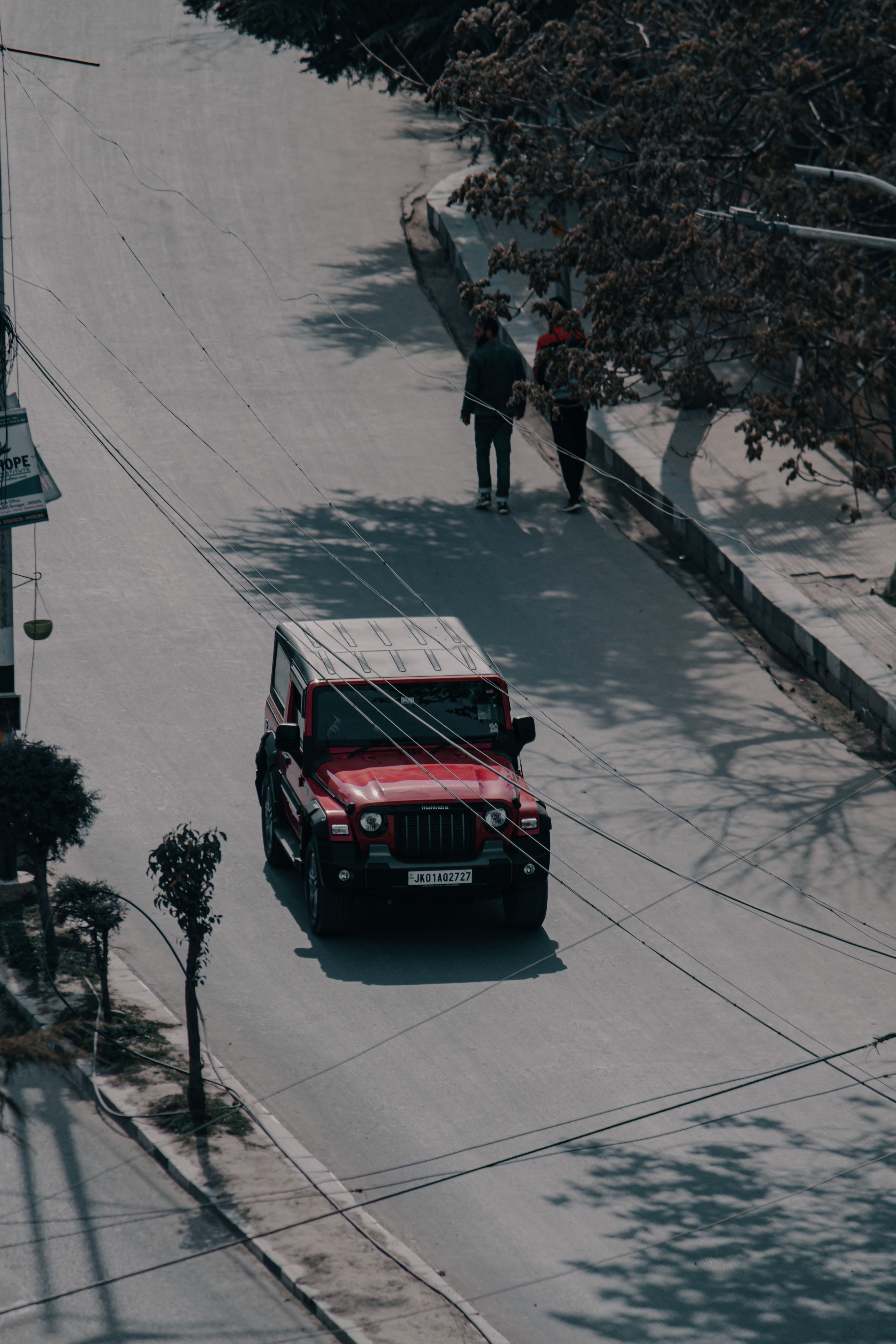 A Red Car Driving on the Road · Free Stock Photo
