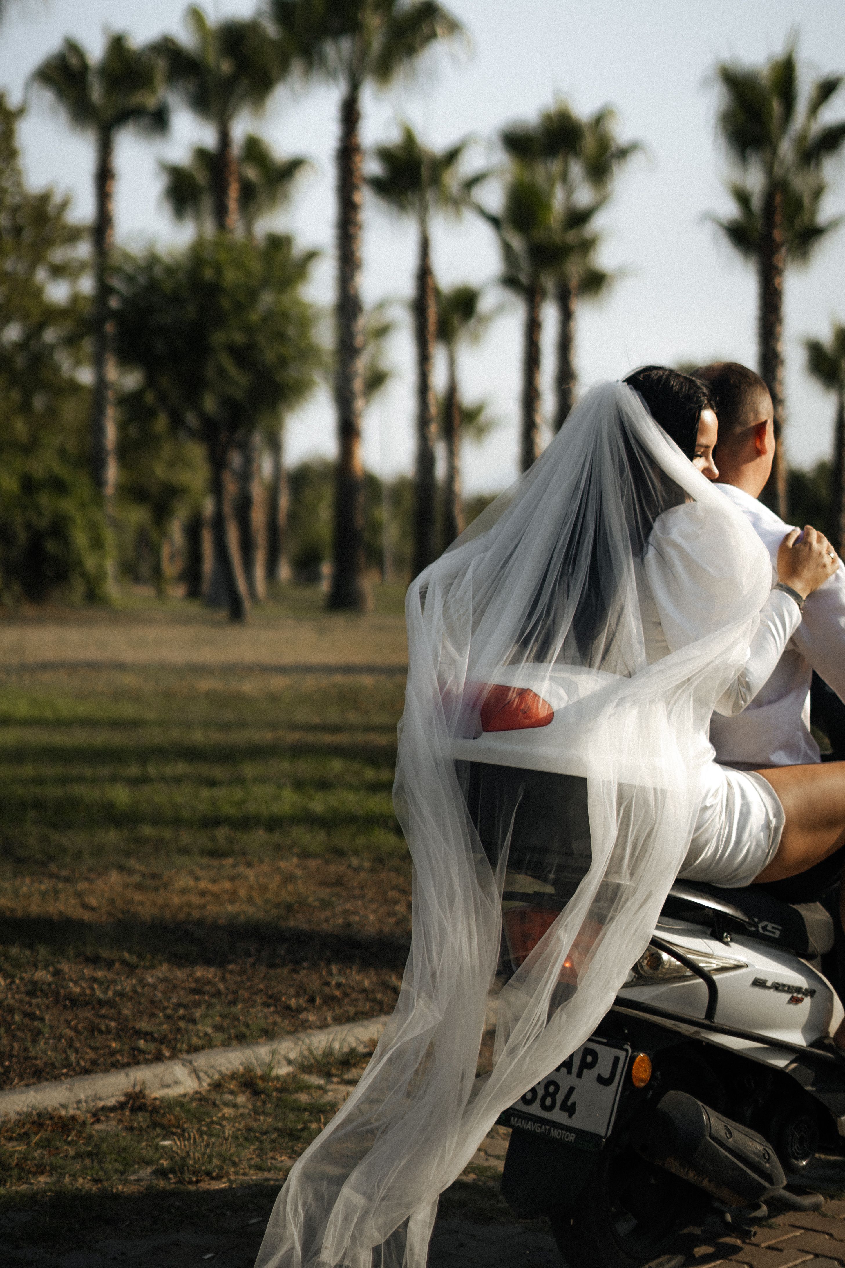 Bride and Groom Riding Motorbike · Free Stock Photo