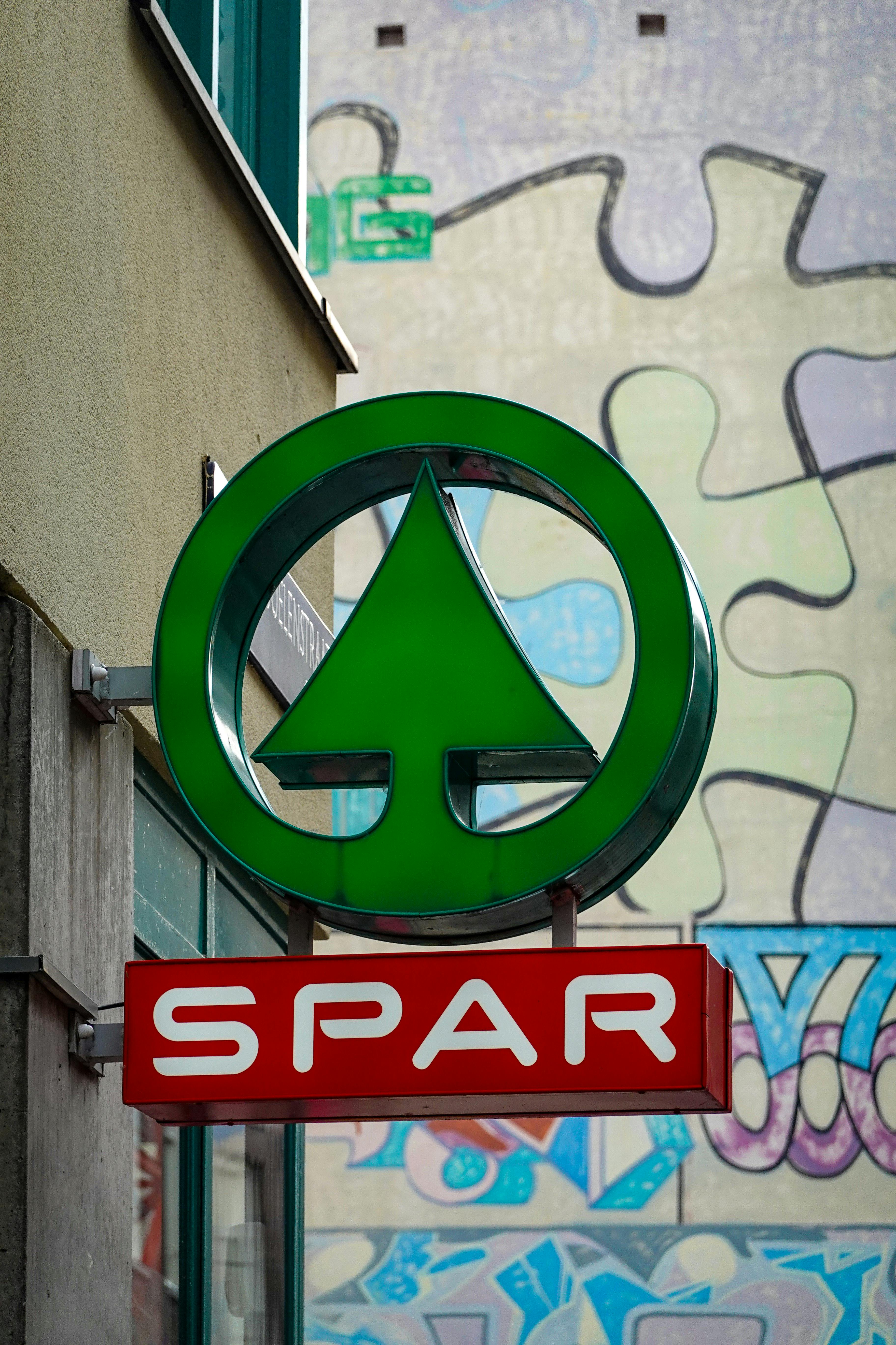 Spar Signage Hanging on a Wall · Free Stock Photo