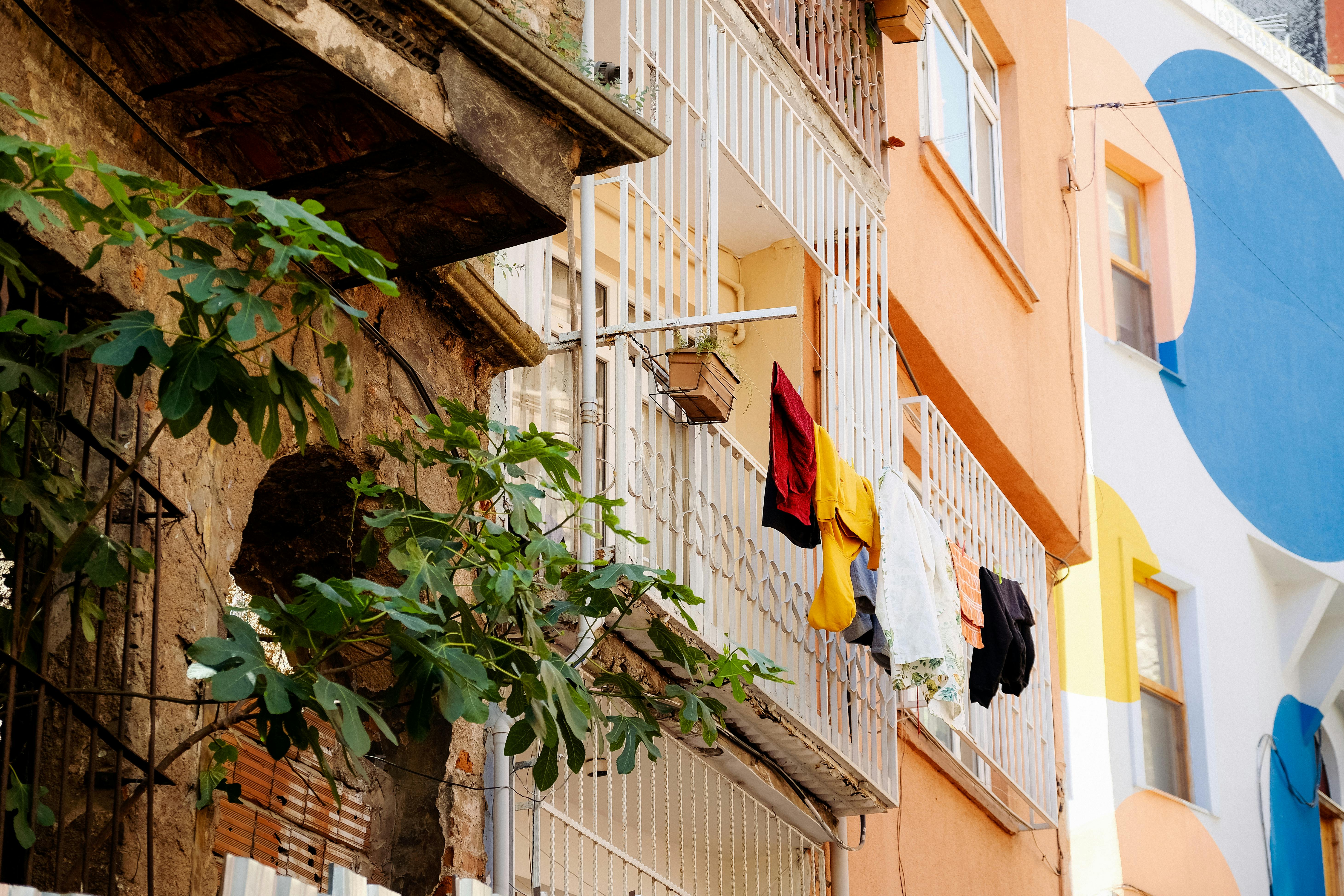 Clothes Line Beside a Concrete Building · Free Stock Photo